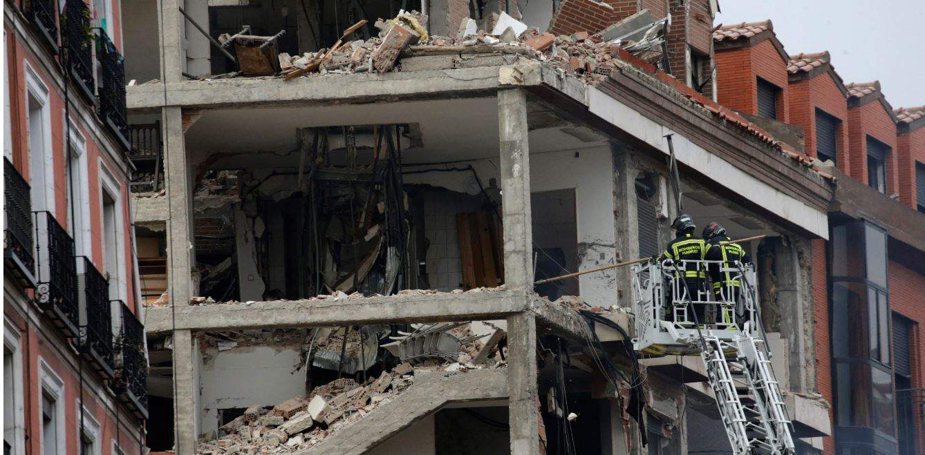At least three dead after building partially destroyed by large ...