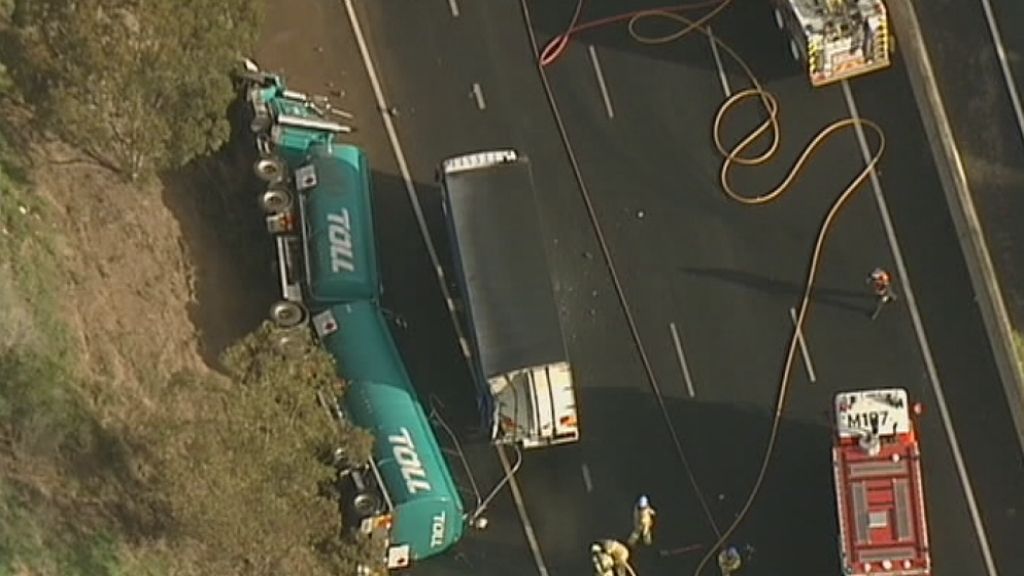 Calder Freeway crash: One dead after petrol tanker rolls, fuel spilt ...