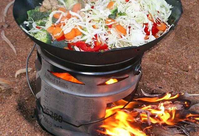 Remote cooking on an old flour drum stove - ABC News