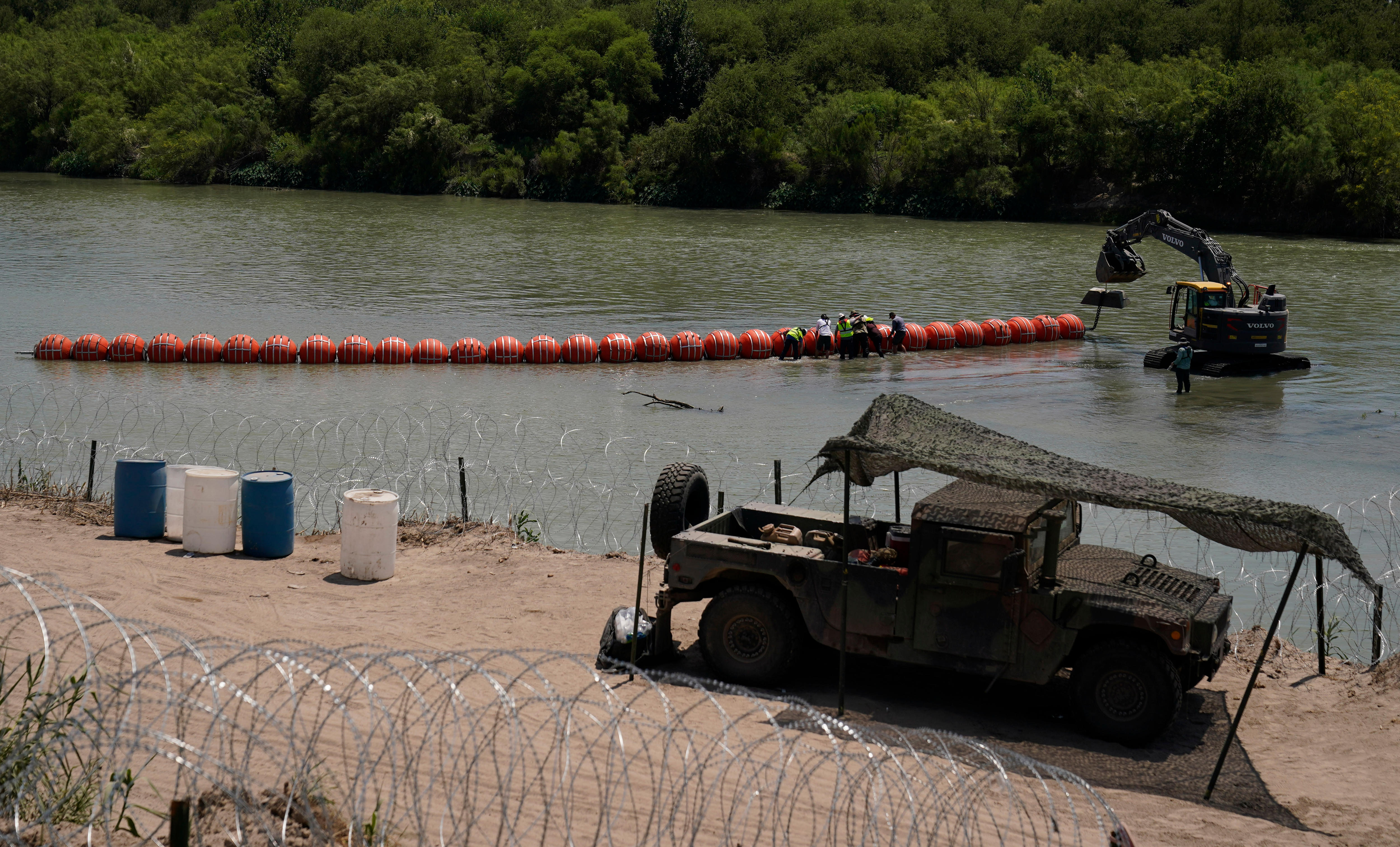 US sues Texas over floating border barriers designed to stop migrants ...