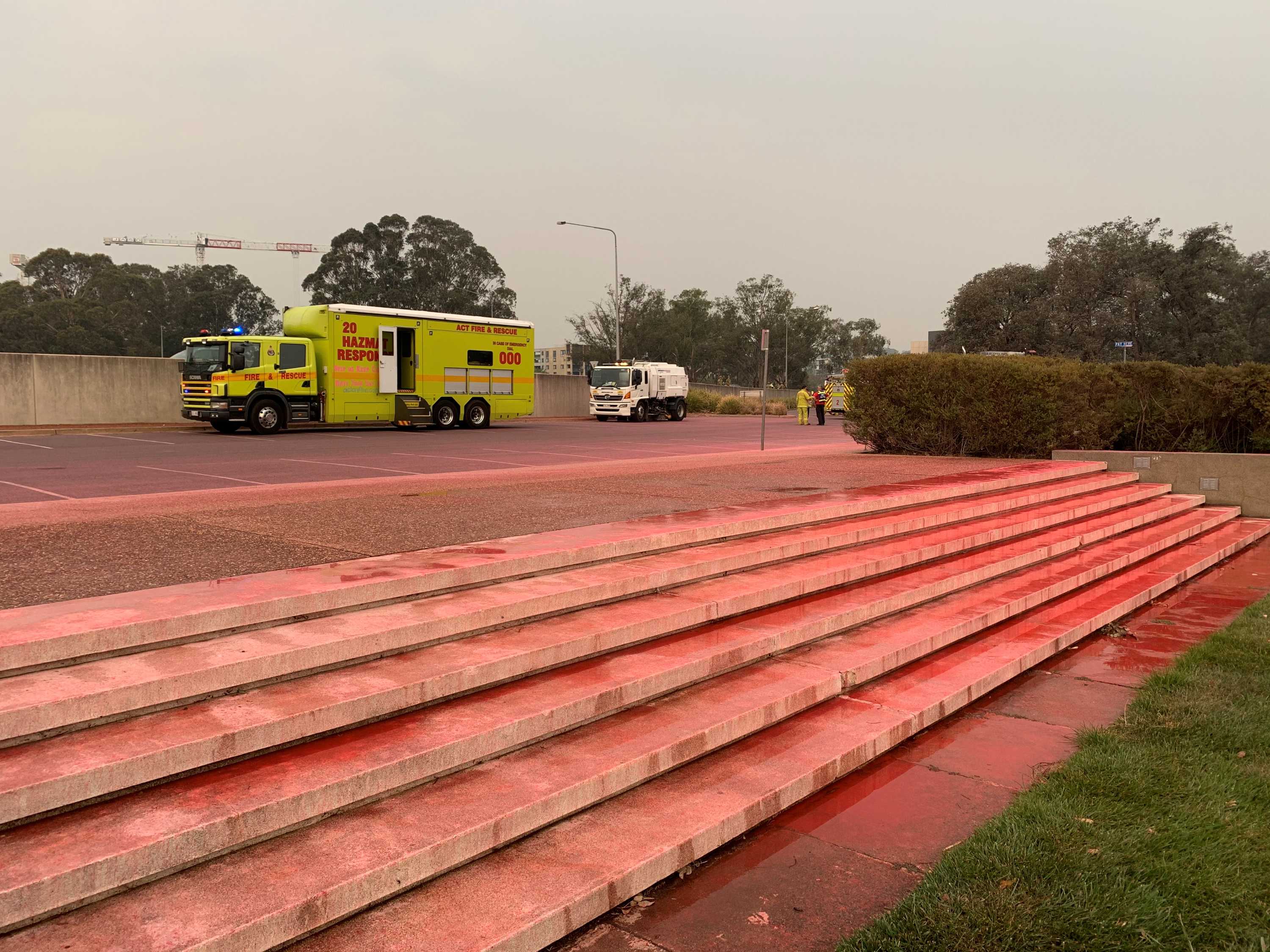 Air tanker accidentally dumps pink fire retardant on busy Canberra road ...