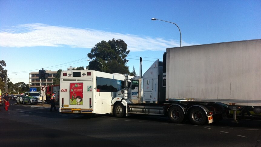 Cyclist, passengers injured after truck and bus collide - ABC News Cyclist, passengers injured after truck and bus collide - ABC News