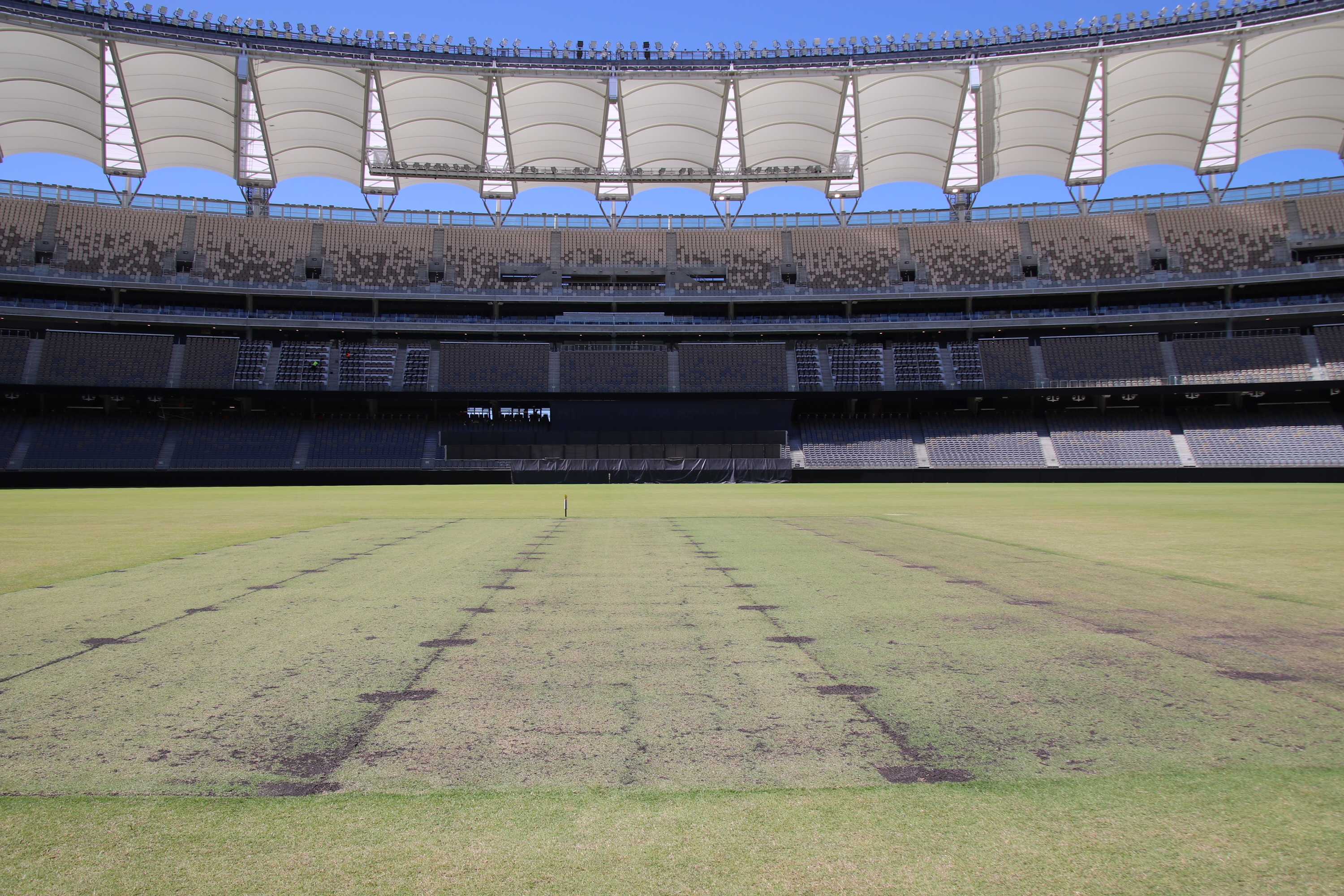 Turf war brewing over Perth Stadium's playing surface could leave grass ...