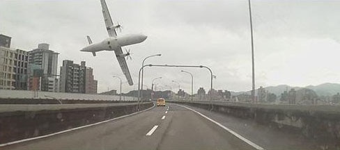Taiwan plane crash: TransAsia pilot found still holding crashed plane's ...