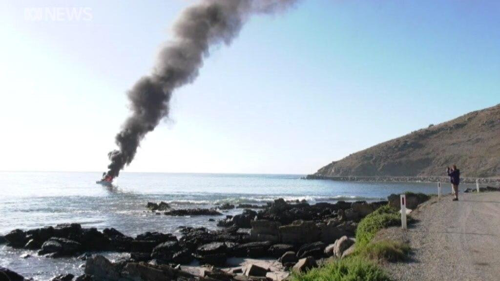 Seven people forced to jump overboard after boat bursts into flames at ...