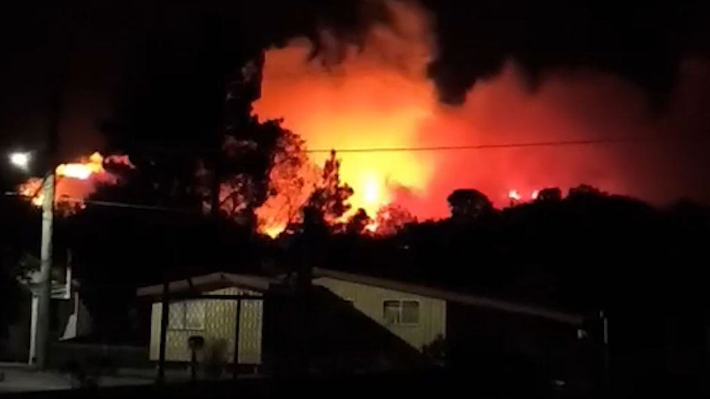 Resident wakes to find hills around Queenstown alight. - ABC News