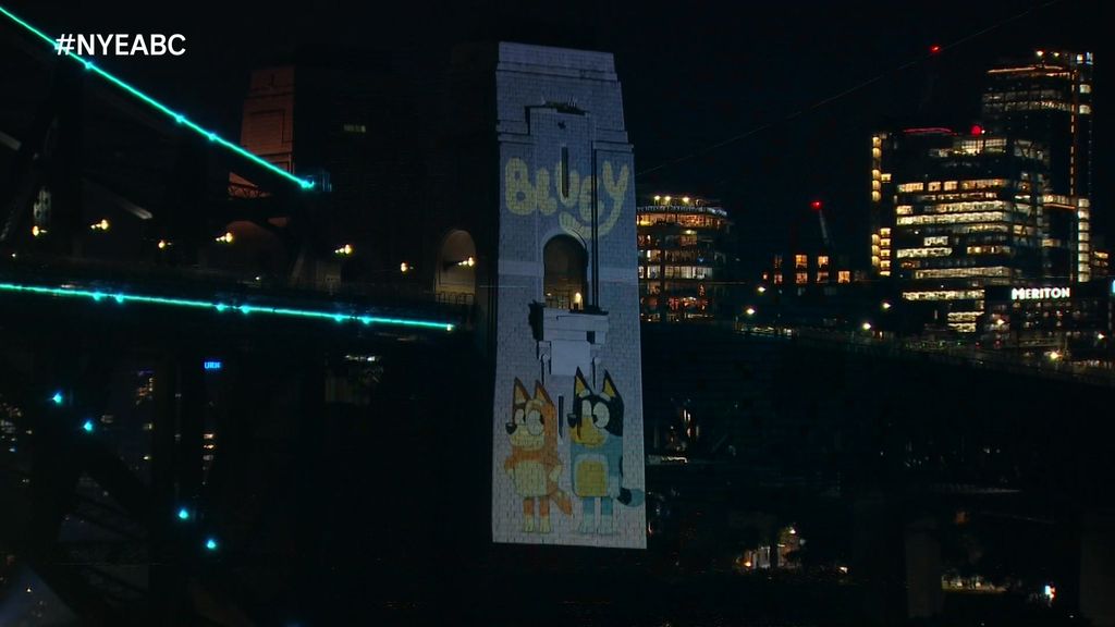 A Bluey dance-off is projected on the Sydney Harbour Bridge pylons ...