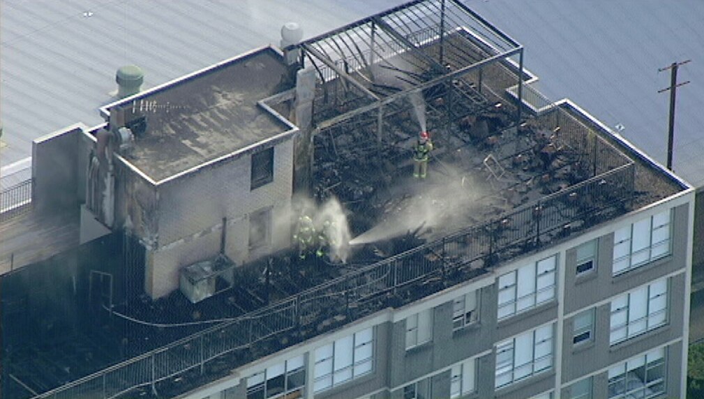 Roof of Sydney apartment block goes up in flames - ABC News