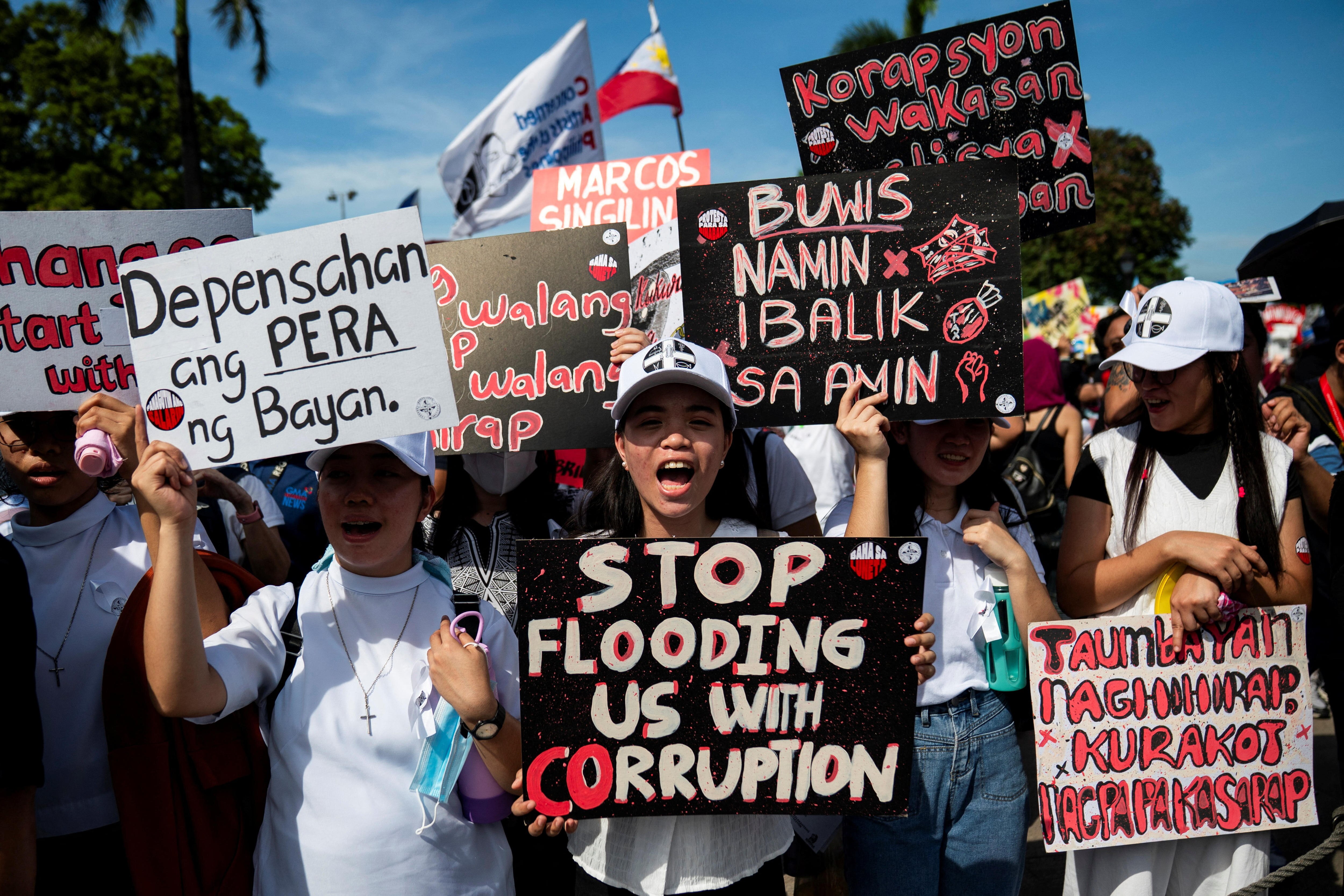 Protesters in Philippines clash with police in rallies against ...
