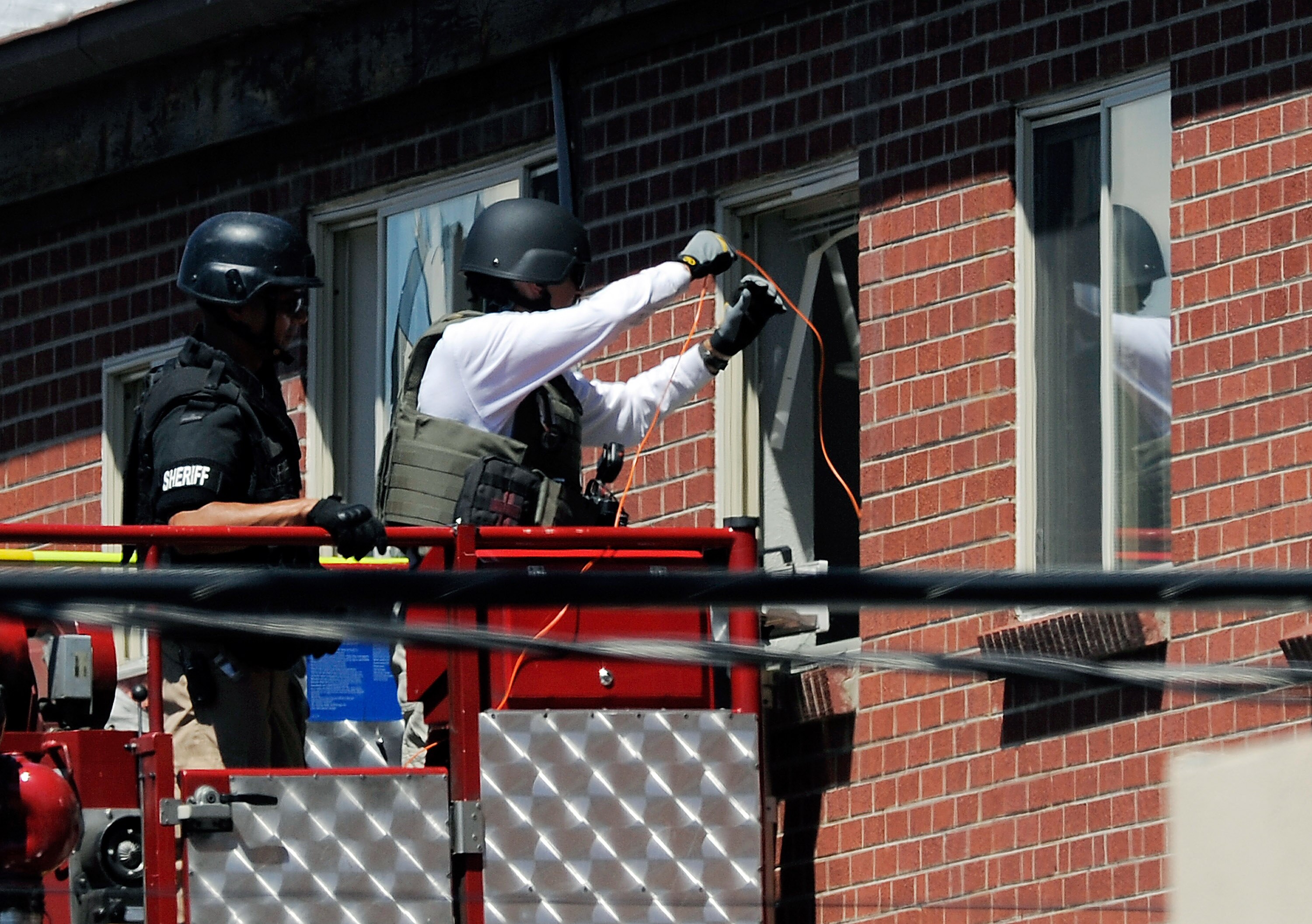 Booby traps removed as shooting victims named - ABC News