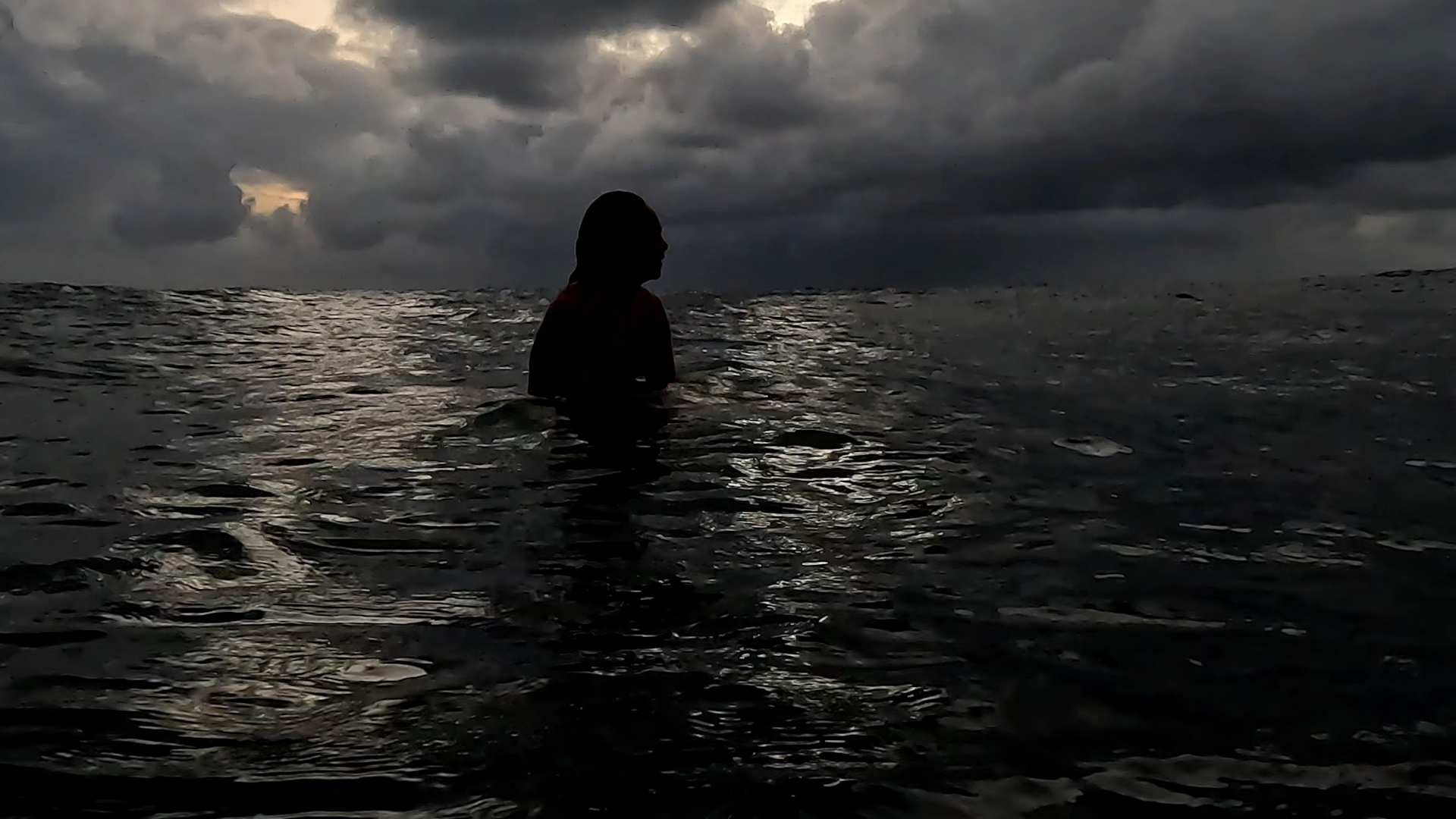 Pomai out in the water surfing - ABC News