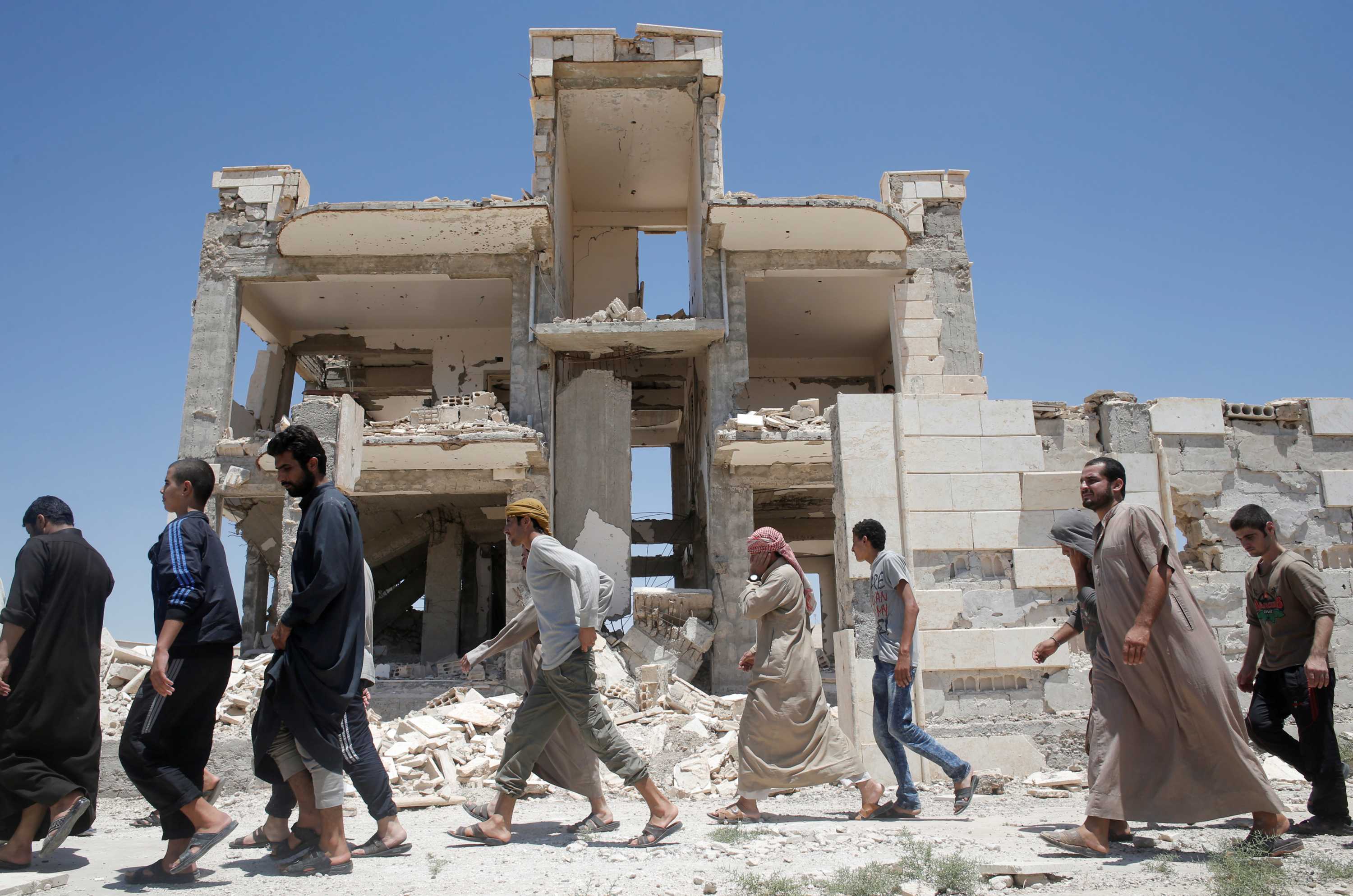 Opposing sides of the Syrian conflict release hundreds of prisoners at ...