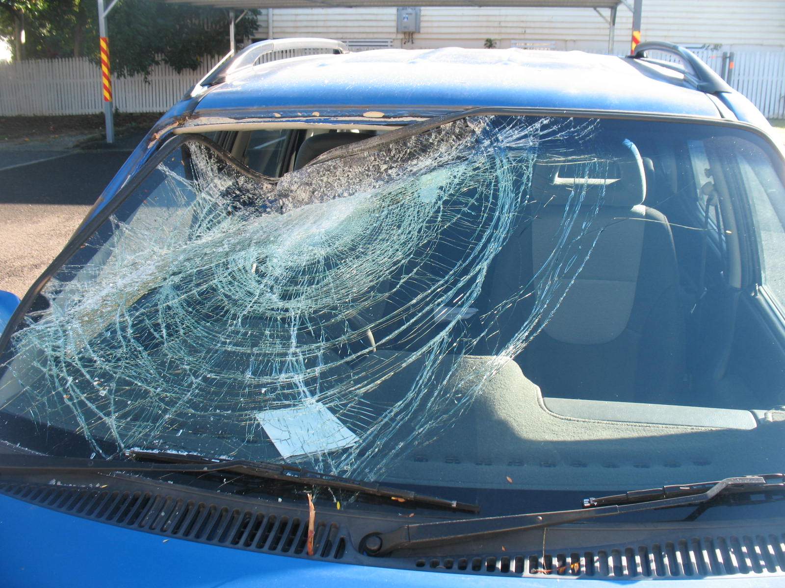 Cars damaged, windscreens shattered after large rocks thrown at moving ...