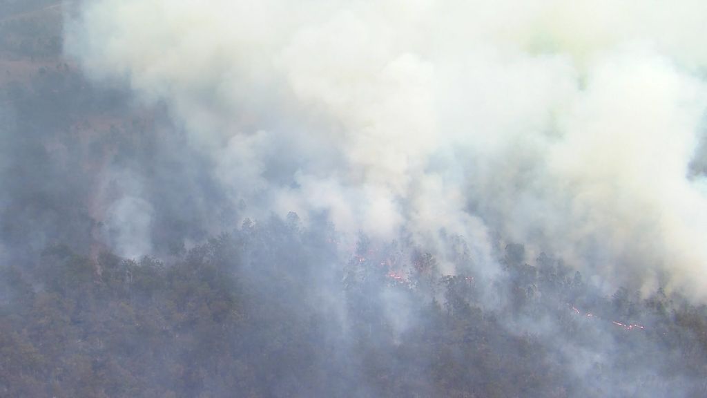Clouds of smoke blowing across Undullah bushland as fires burn. - ABC News