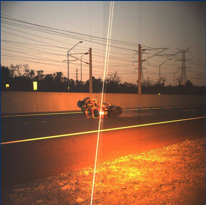Speed camera snaps motorcyclist in shorts and T-shirt coming off bike ...