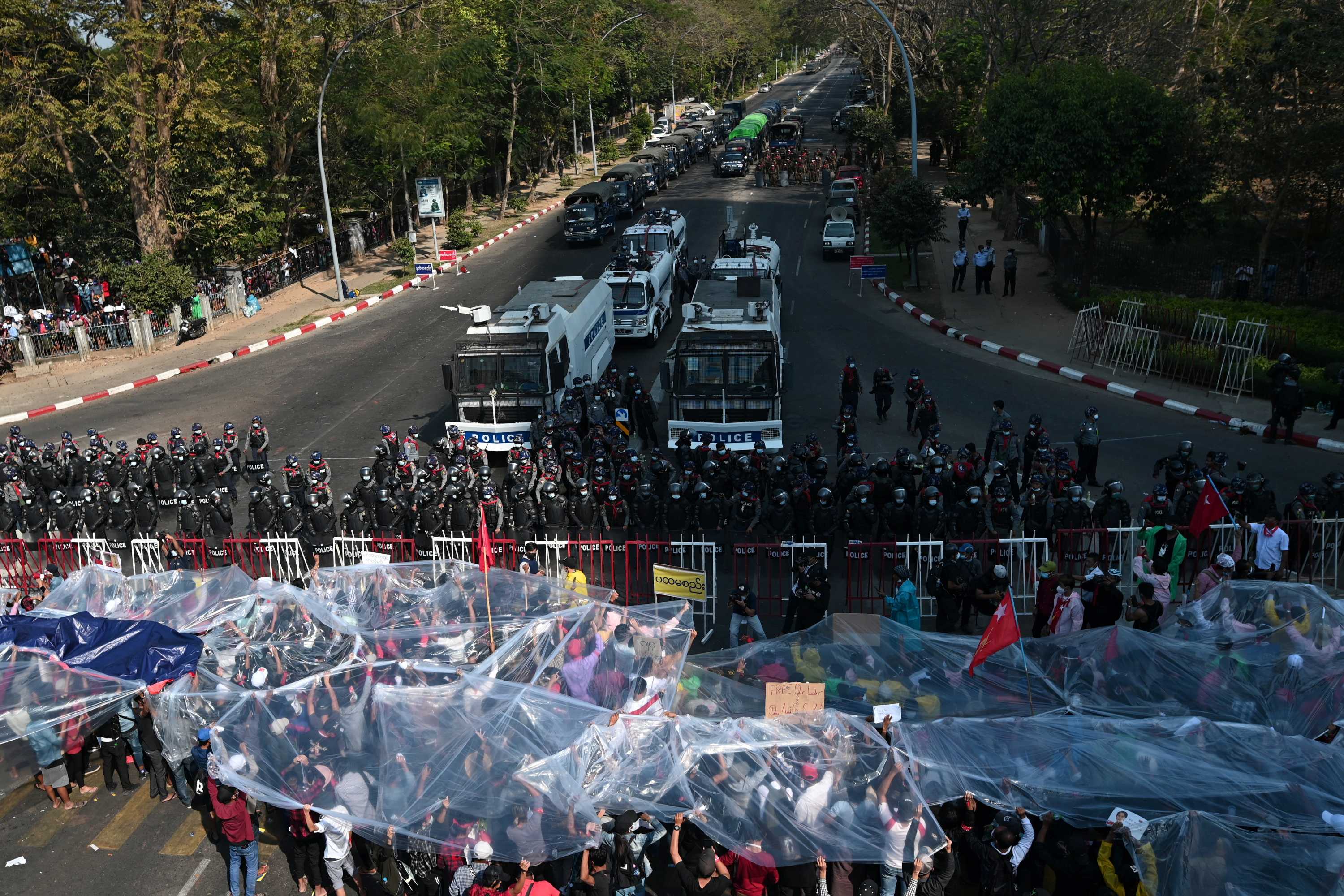 Myanmar police fire to disperse protesters, leaving woman with what ...
