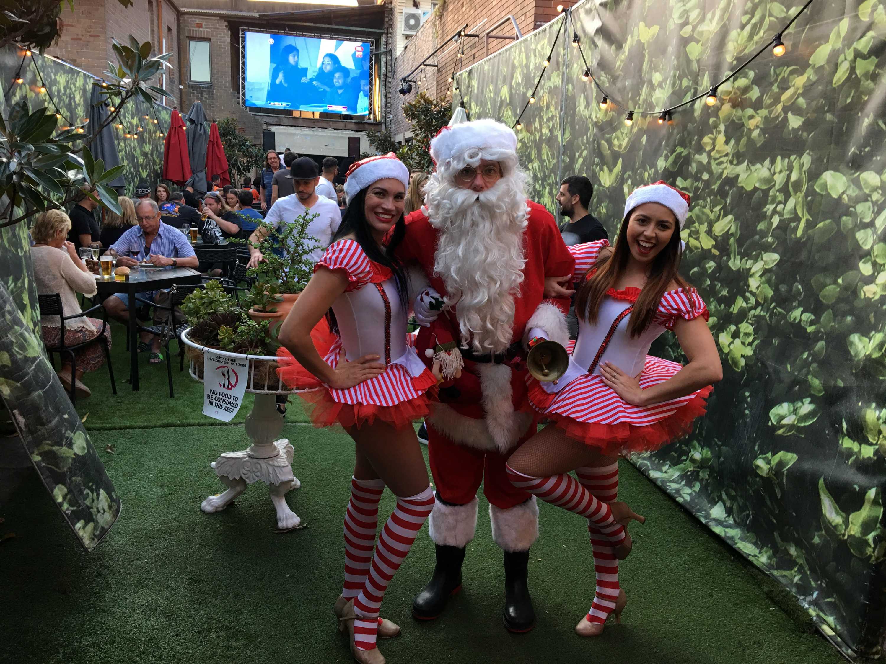 Santa Claus lives up to fantasy delivering presents to Sydney homes at ...