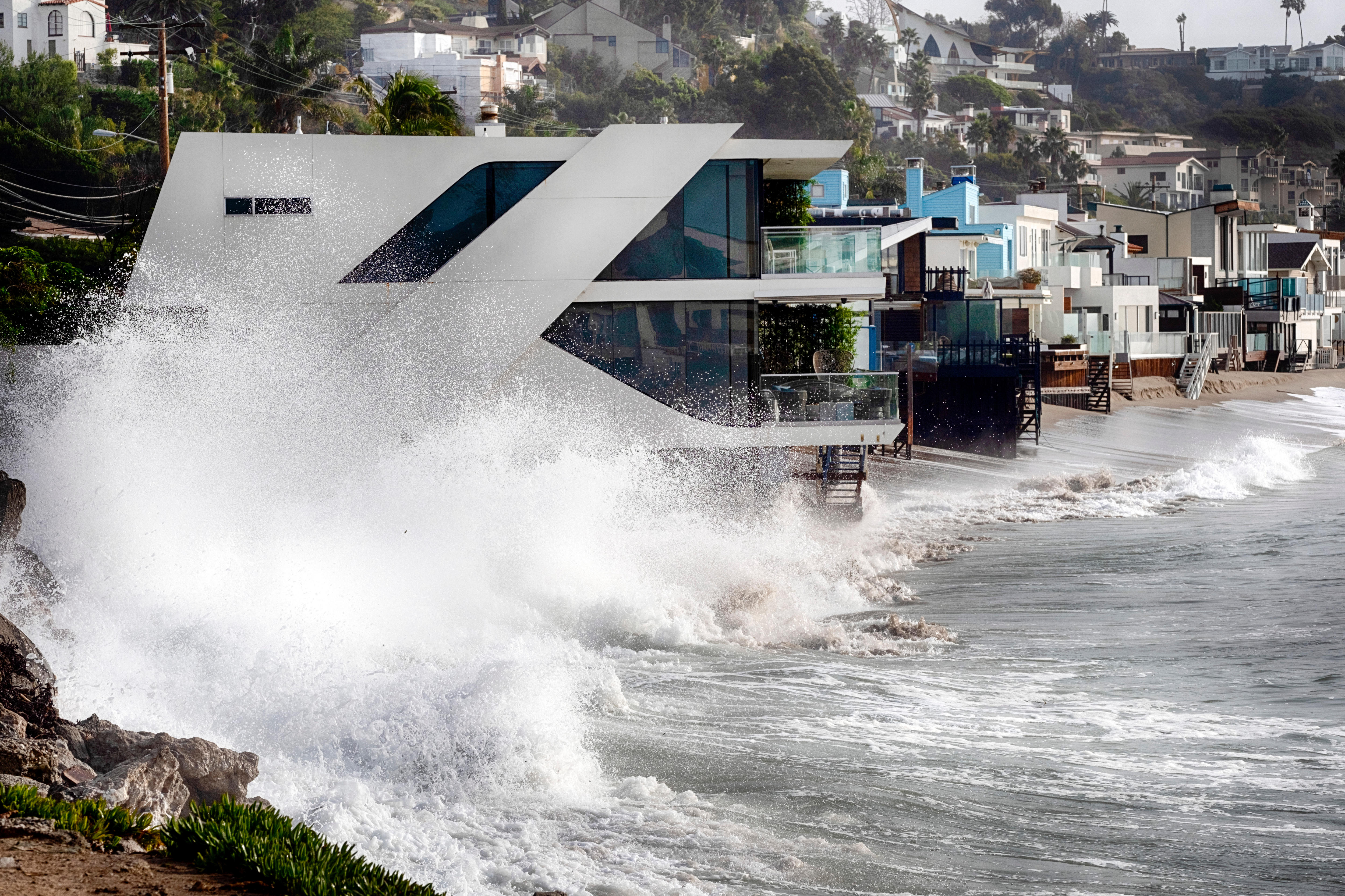 Pictures show destruction as huge surf pounds US West Coast, flooding ...
