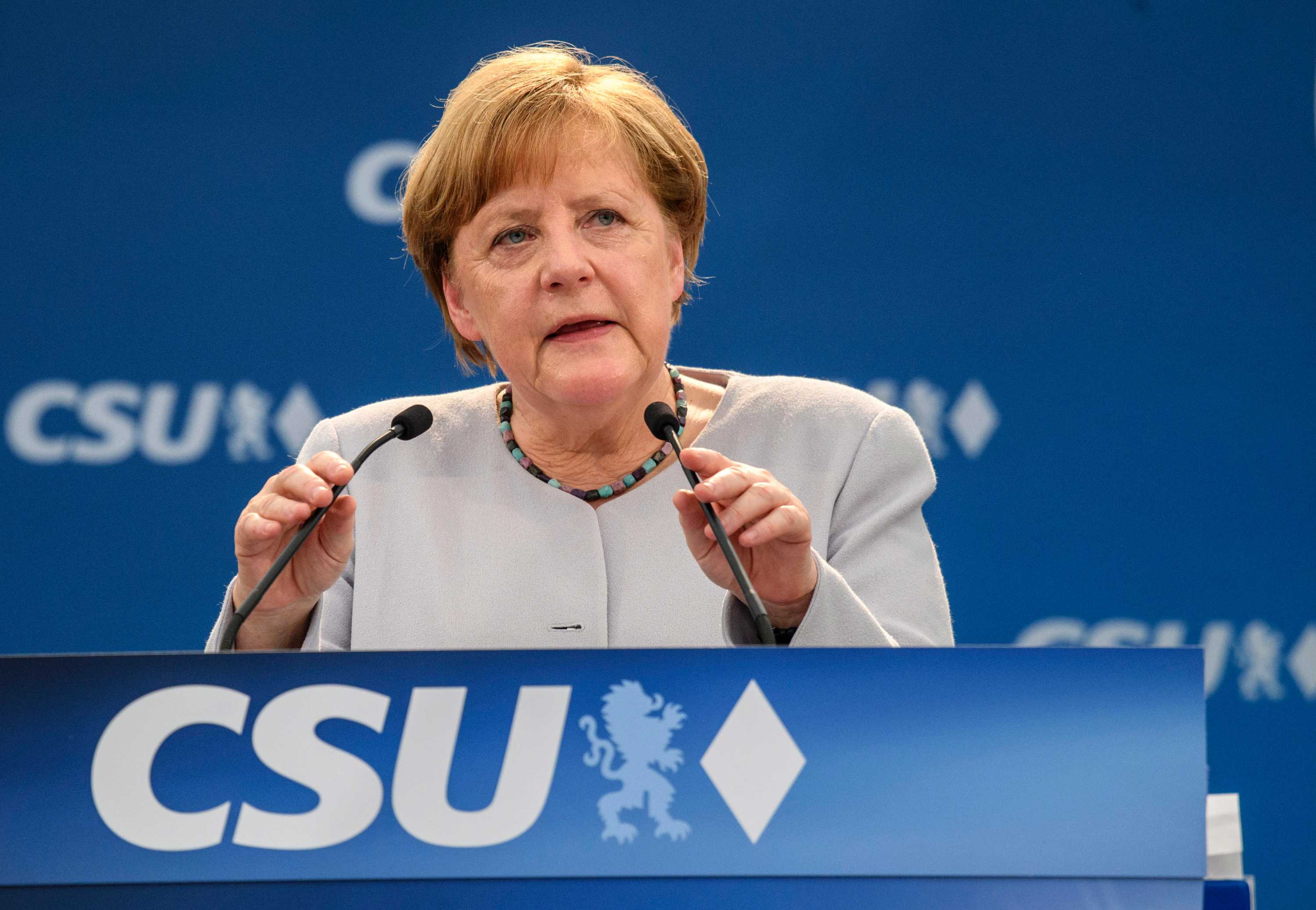 Angela Merkel's conservative party agrees to pursue grand coalition in ...