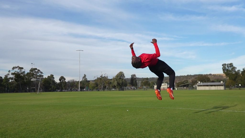 Soccer player Amlani Tatu flipping on the field - ABC News