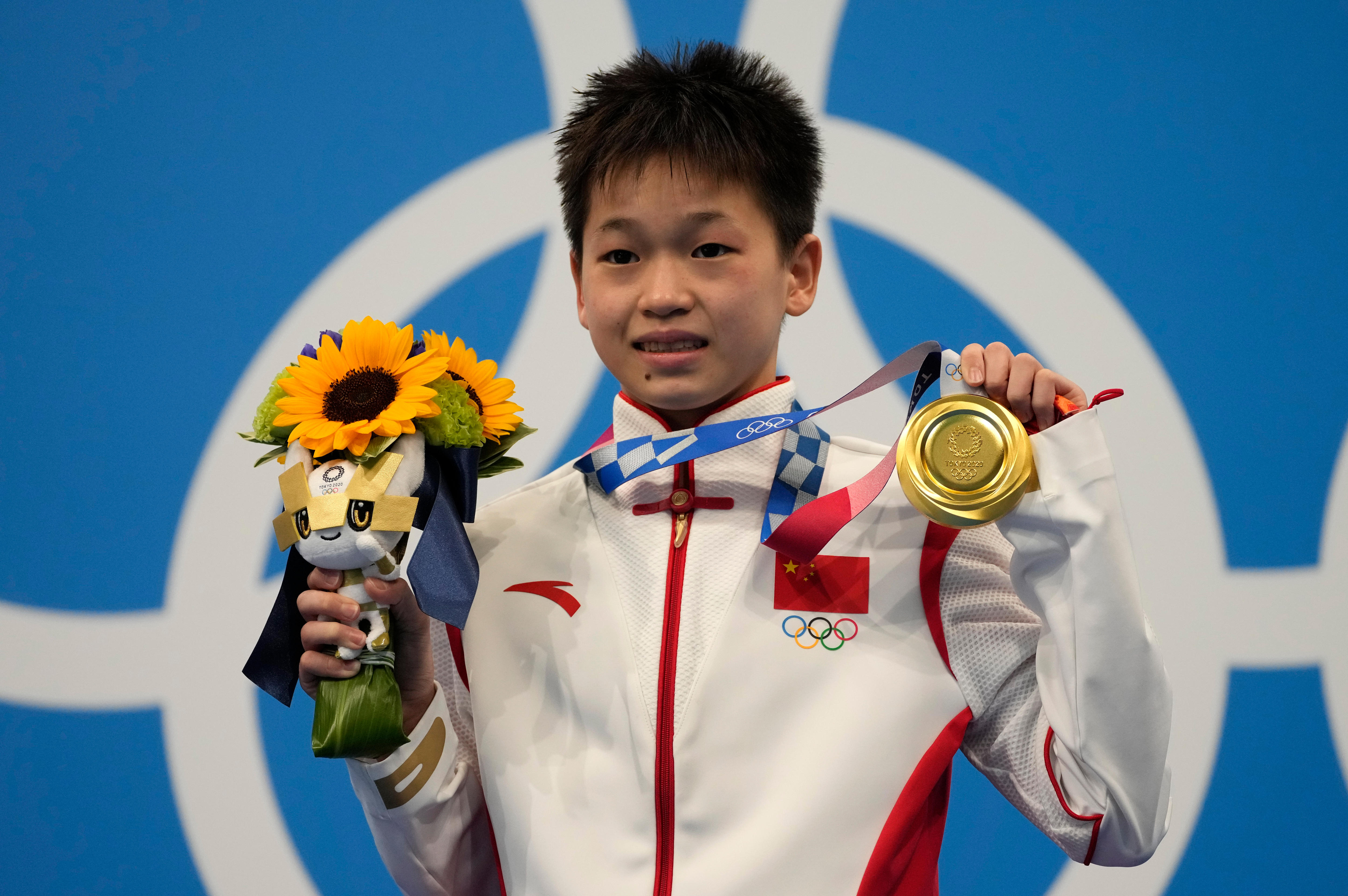 Chinese diving superstar Quan Hongchan's village mobbed by fans after ...