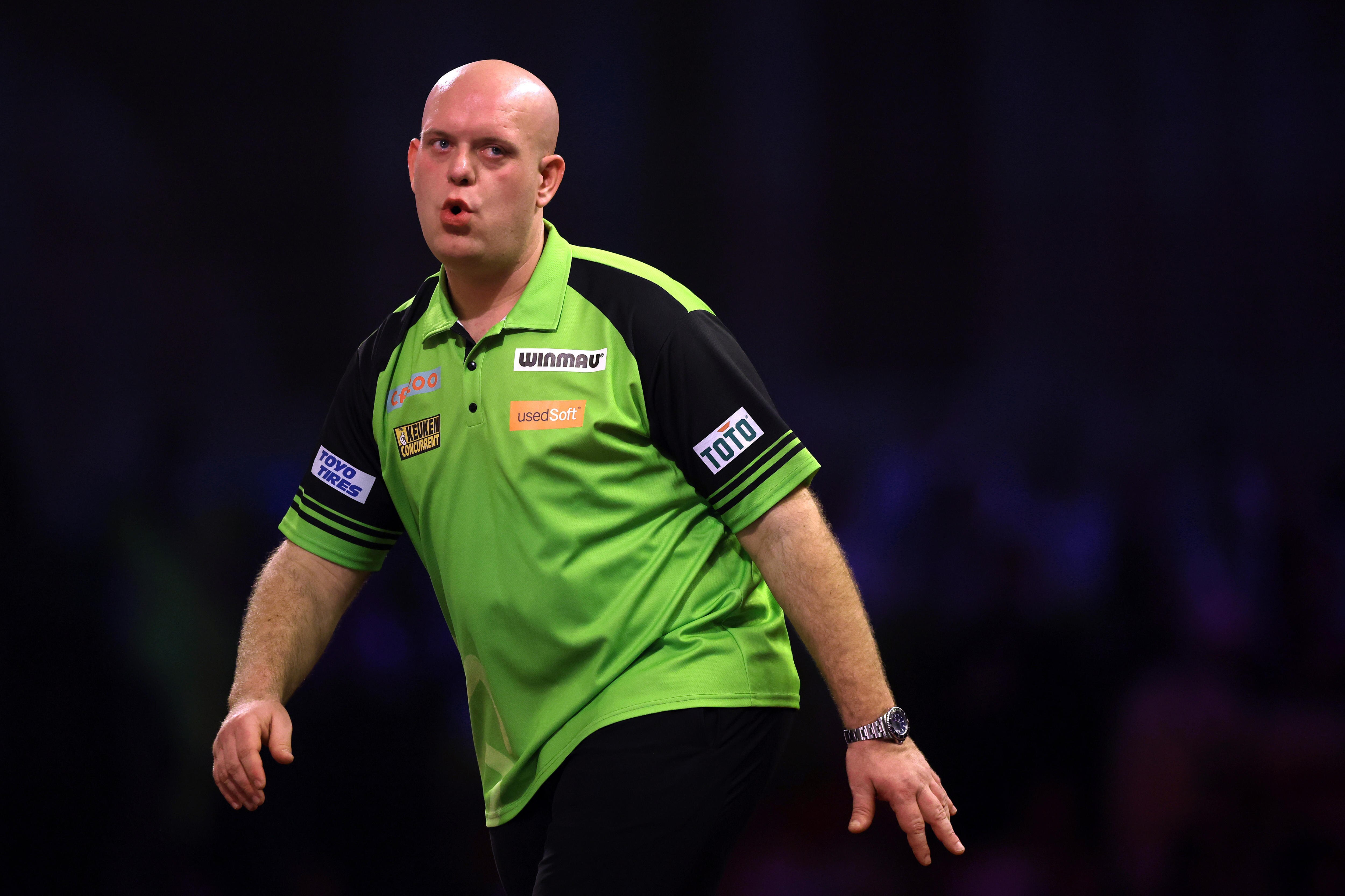 England's Michael Smith hits a nine-dart finish on the way to the PDC ...