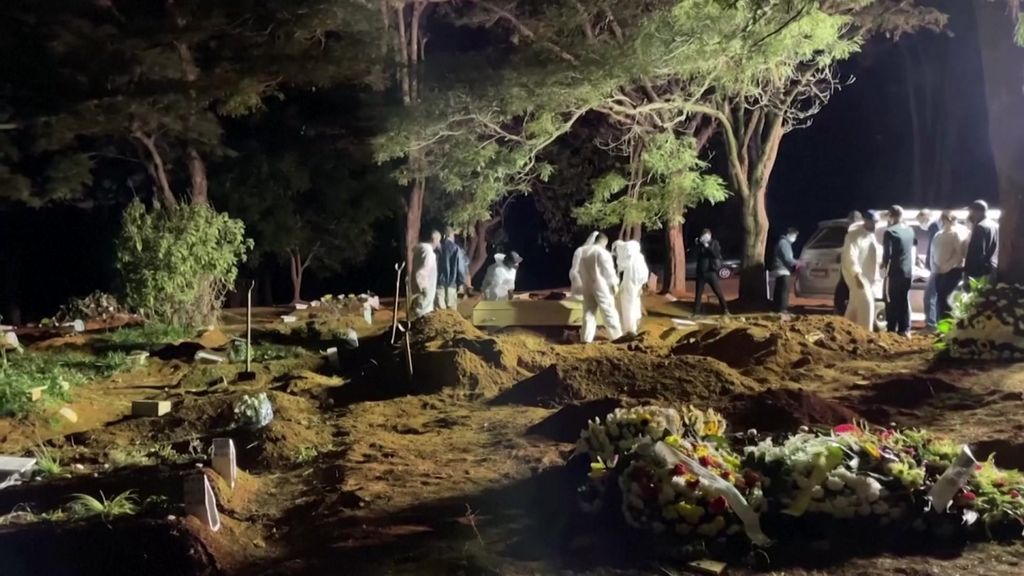 Burials and funerals take place at night as Brazil's COVID death toll ...