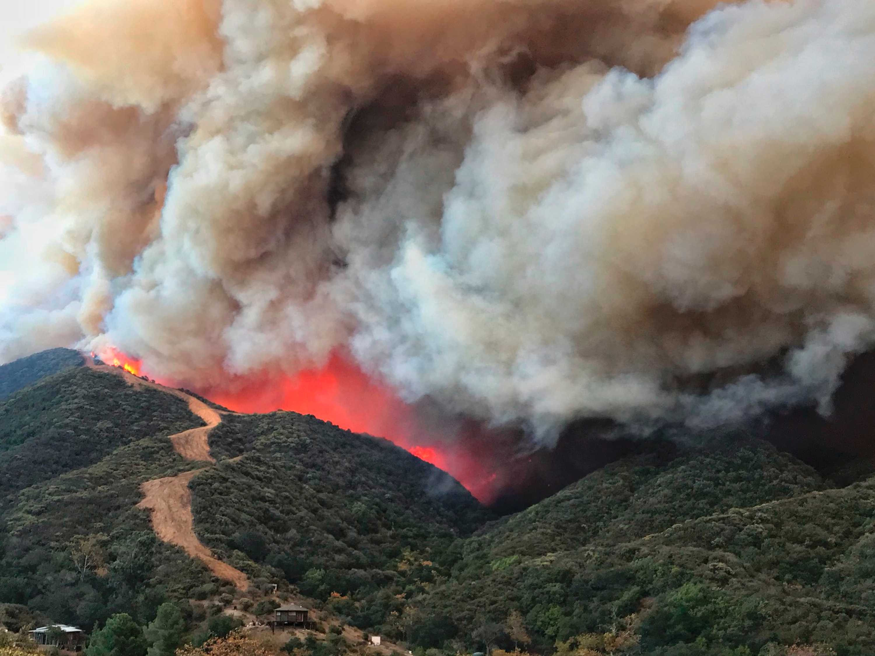 California fires: Thousands flee as wildfire 'beast' grows to state's ...
