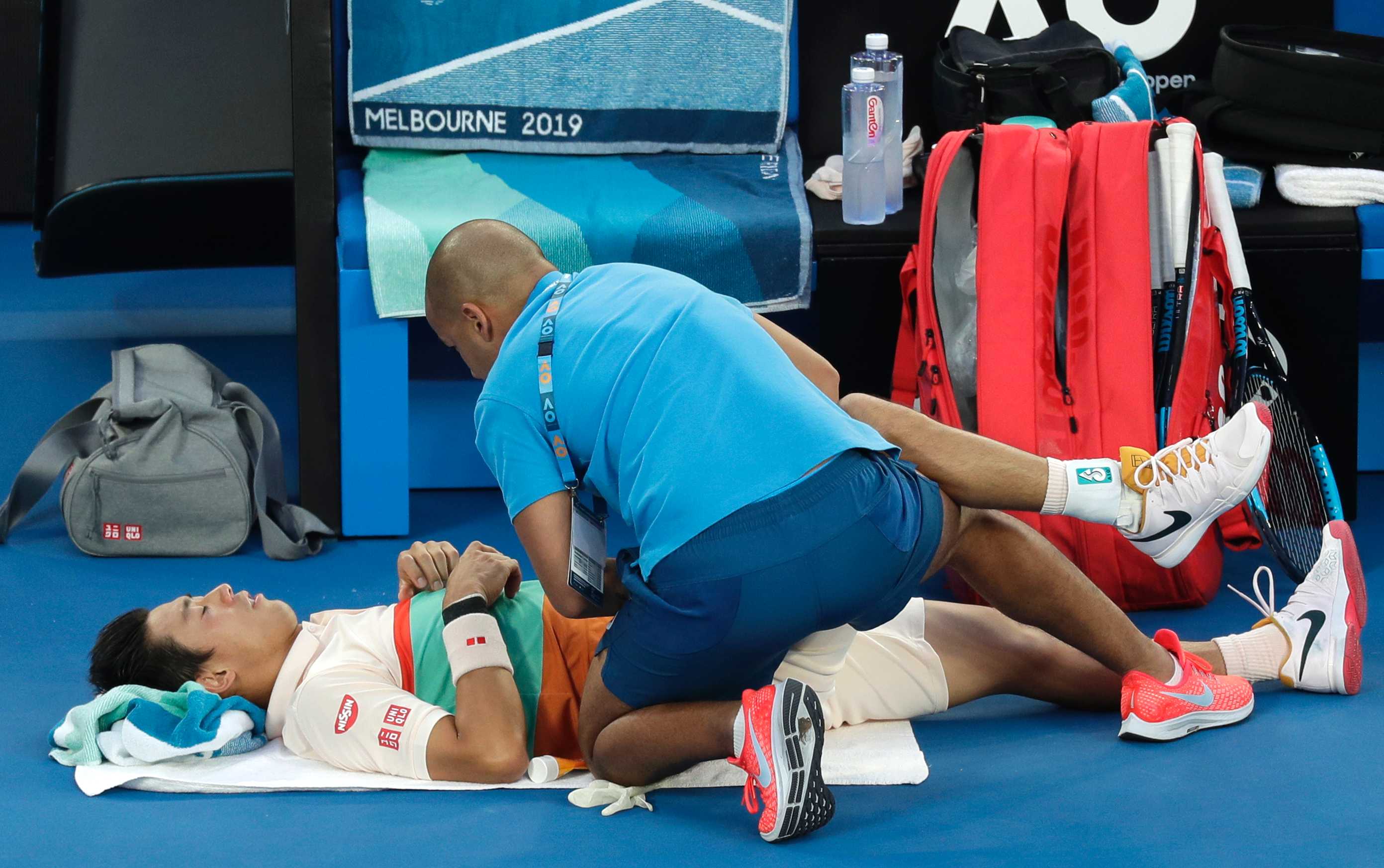 Novak Djokovic moves into Australian Open semis as injury forces Kei ...