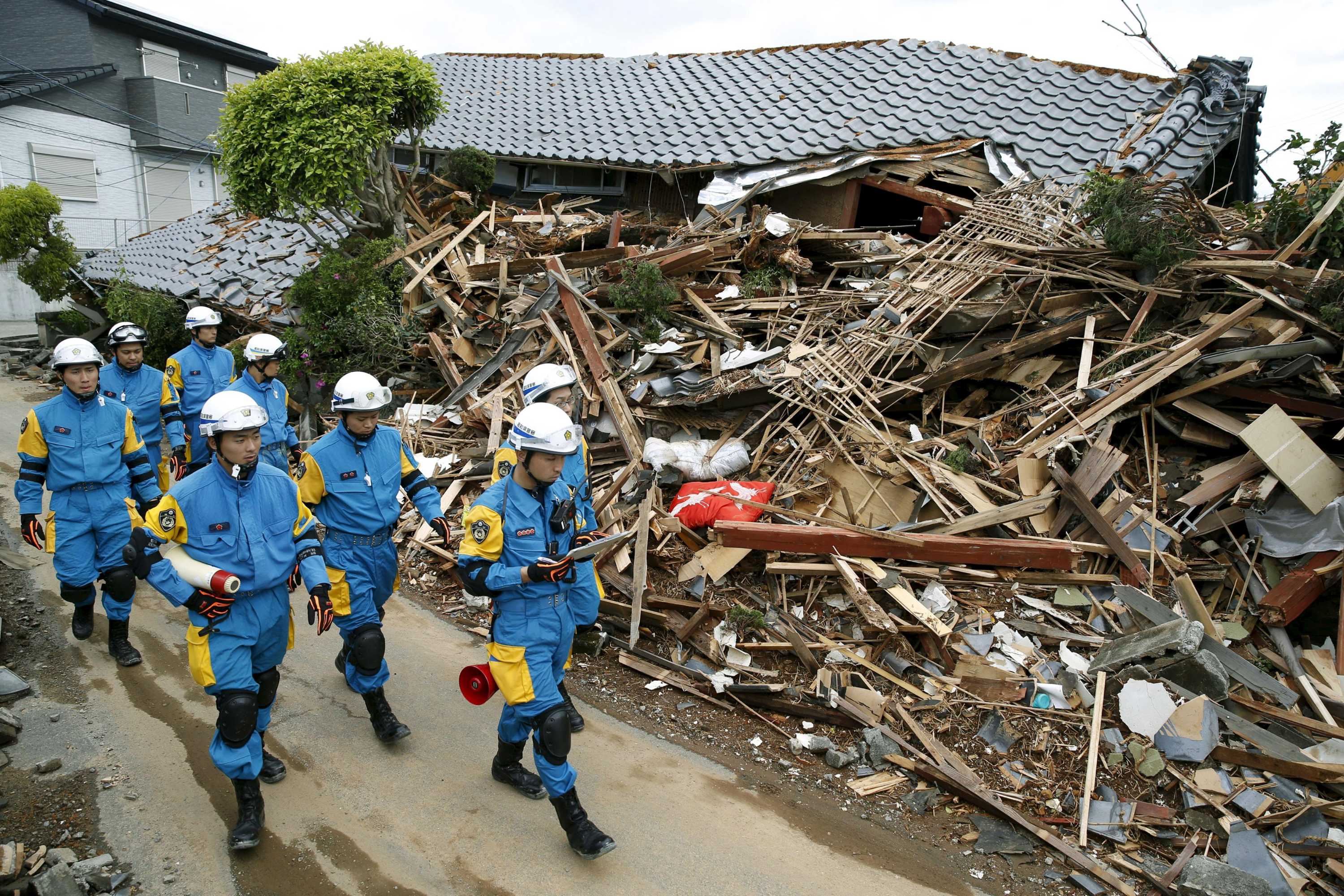 Japan earthquakes: Rescuers race against weather to reach trapped ...