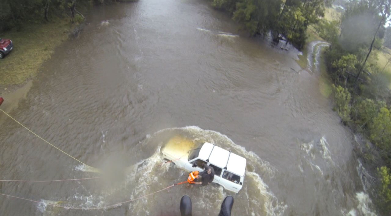 Heavy rain and flash flooding across NSW prompt emergency rescues - ABC ...
