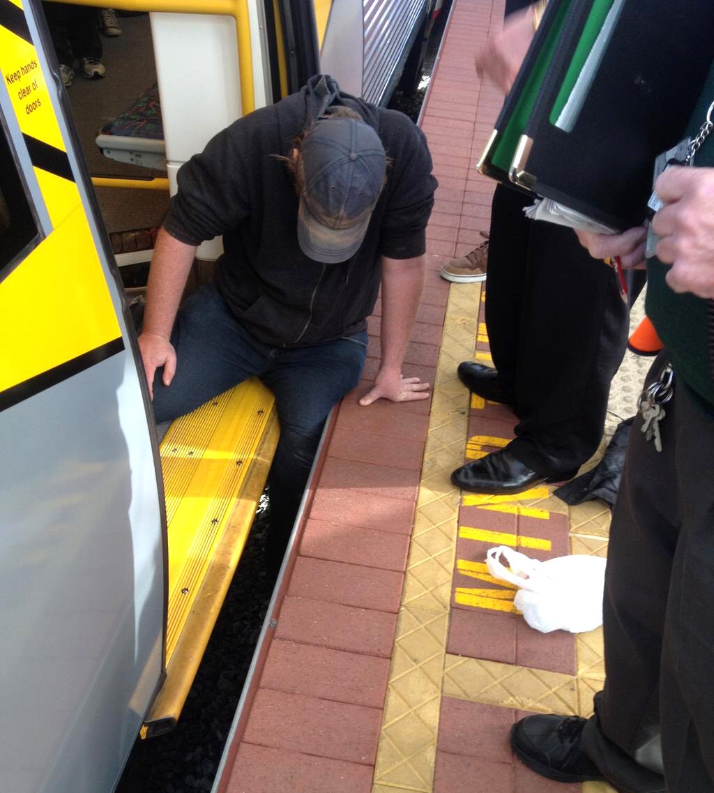 Train rescue: Commuters use people power to free man trapped against ...