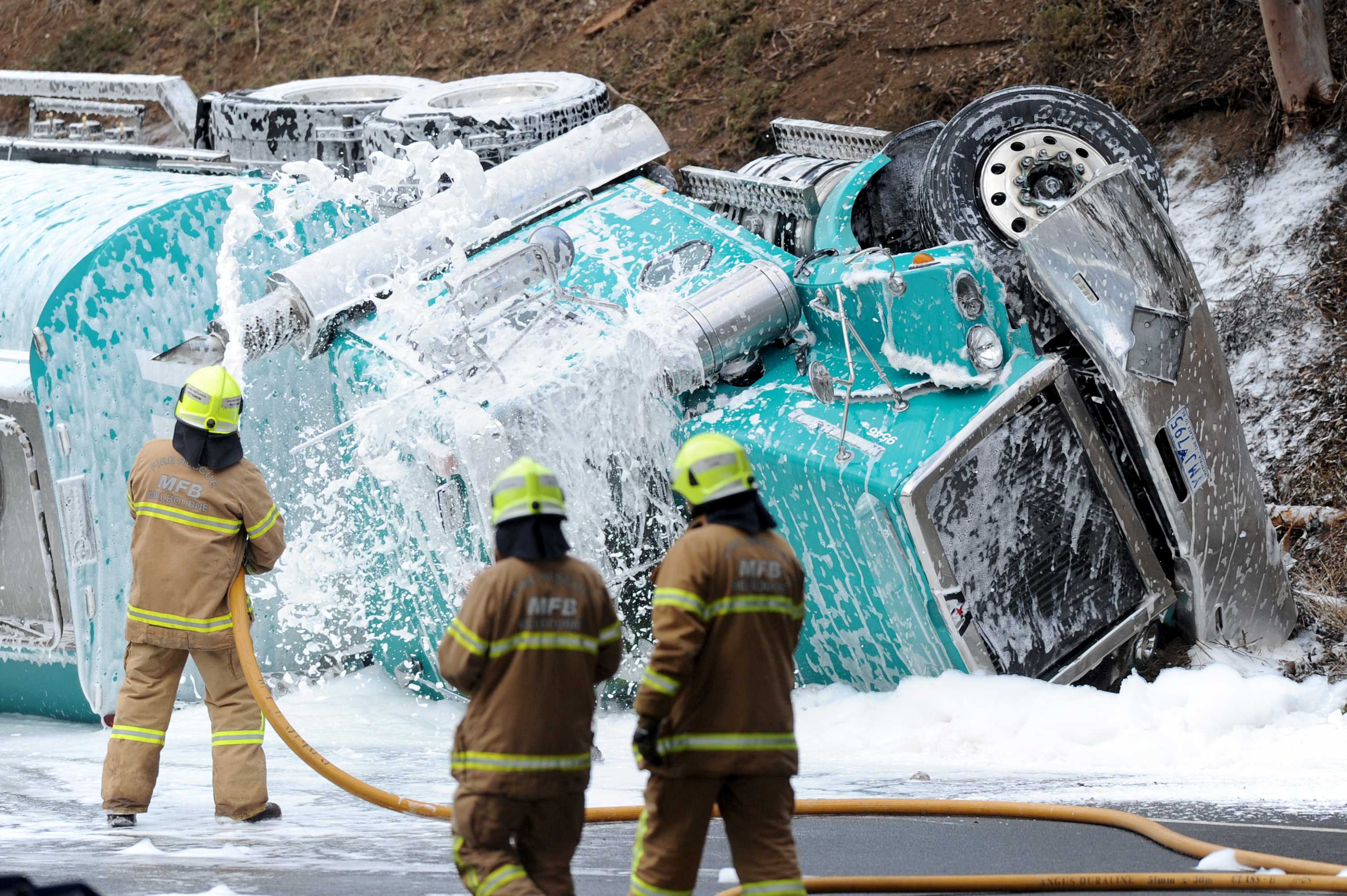 Calder Freeway crash: One dead after petrol tanker rolls, fuel spilt ...