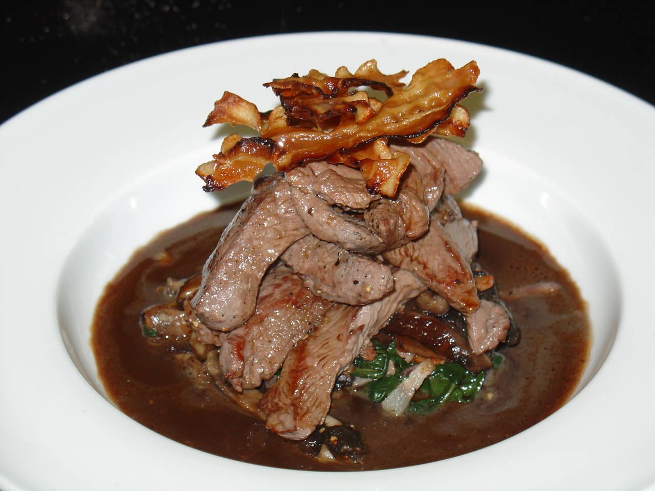 Strips of venison with mushrooms, bacon and spinach with a chocolate ...