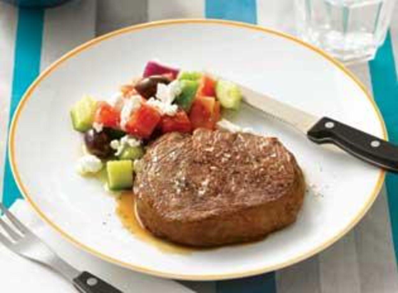 Barbecued scotch fillet steak with a Greek salad - ABC News