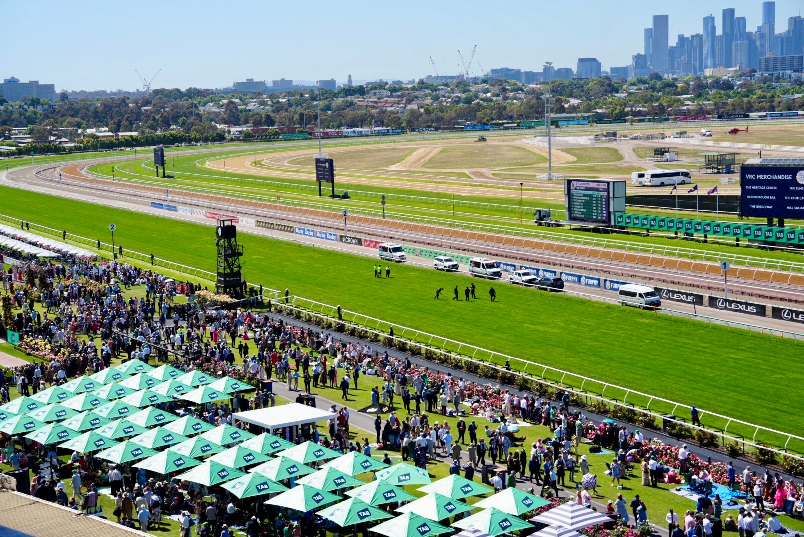 Melbourne Cup goers celebrate at Flemington Racecourse under warm and ...