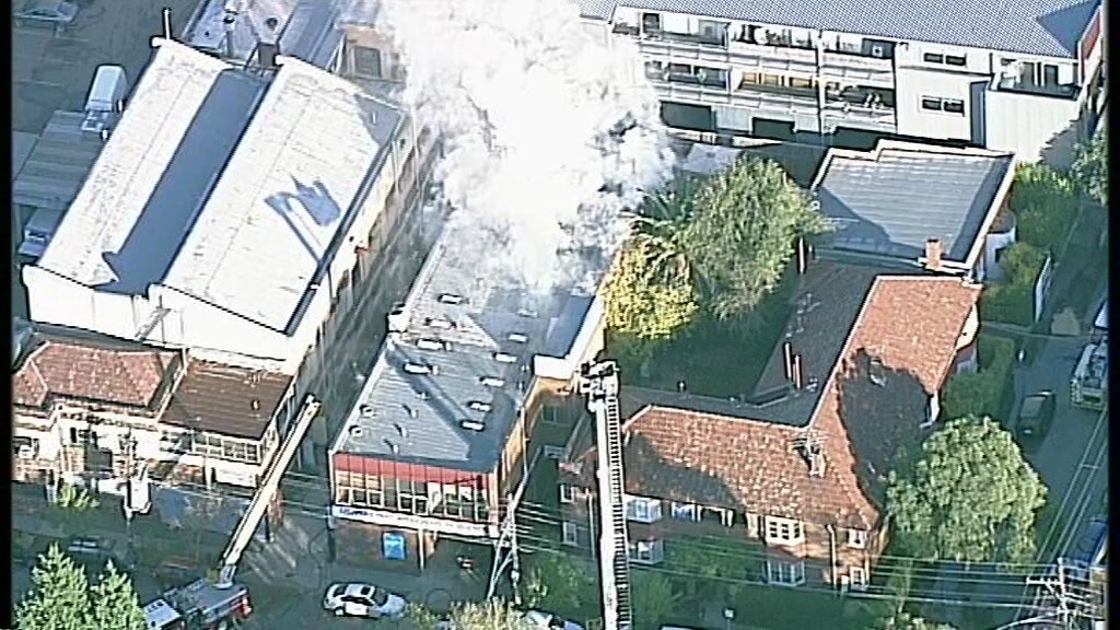 Woman injured after jumping from burning disused factory in Melbourne ...