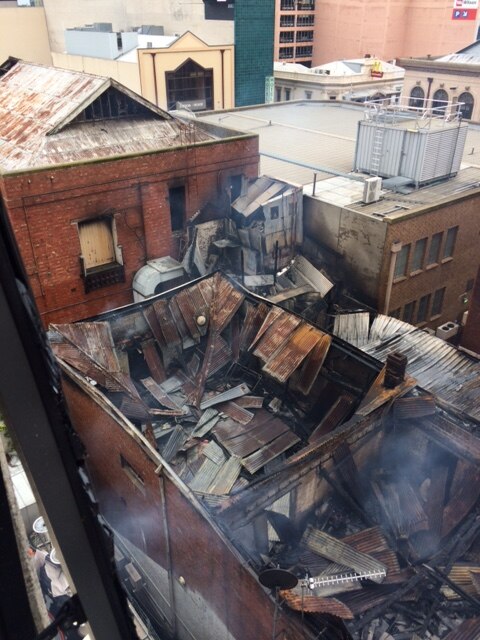 Fire crews extinguish large blaze in Adelaide's CBD; building's roof ...