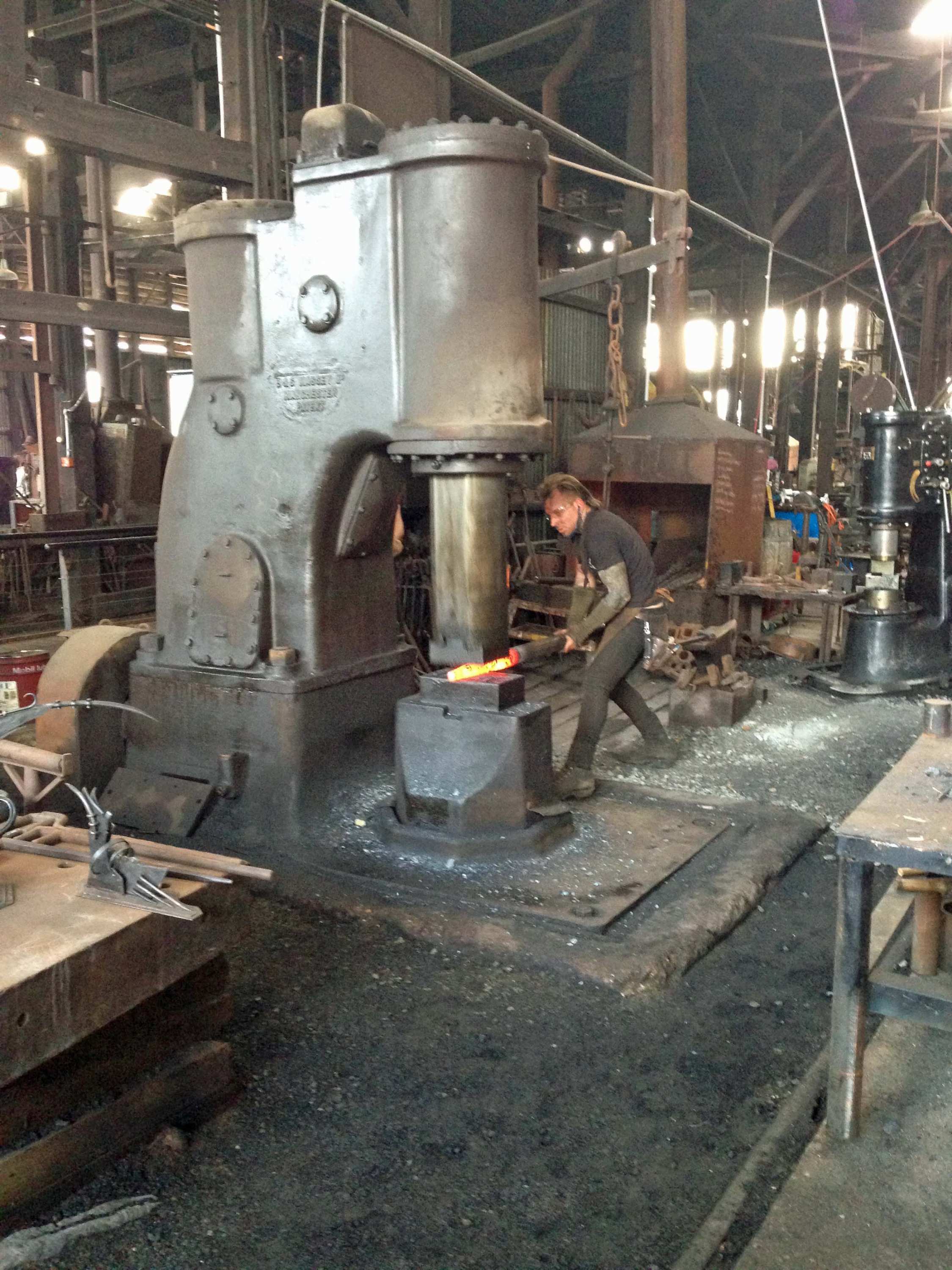Fire-shooting steel sculpture breathes new life into old rail workshop ...