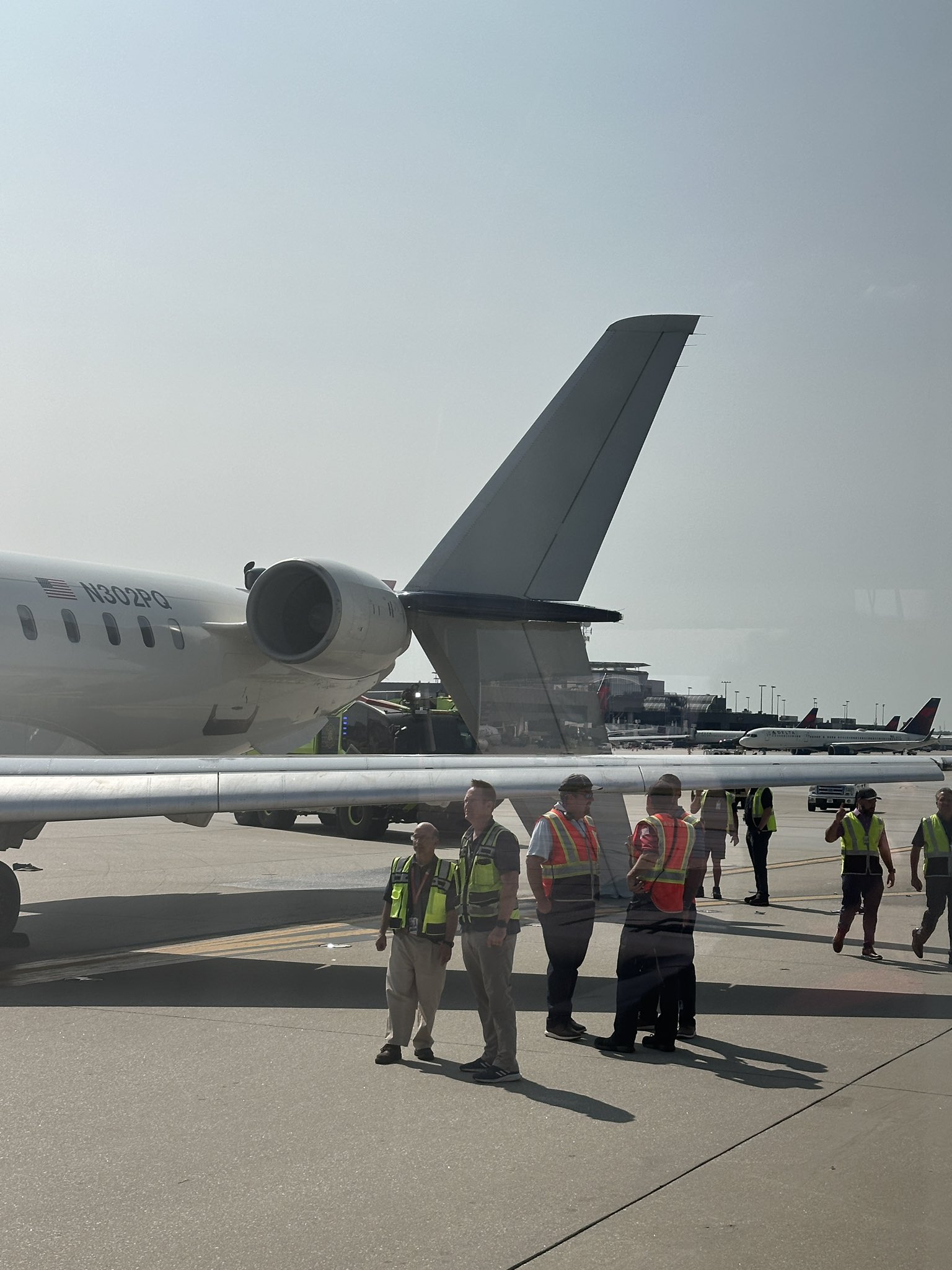 Tail section knocked off Delta plane during collision at Atlanta ...