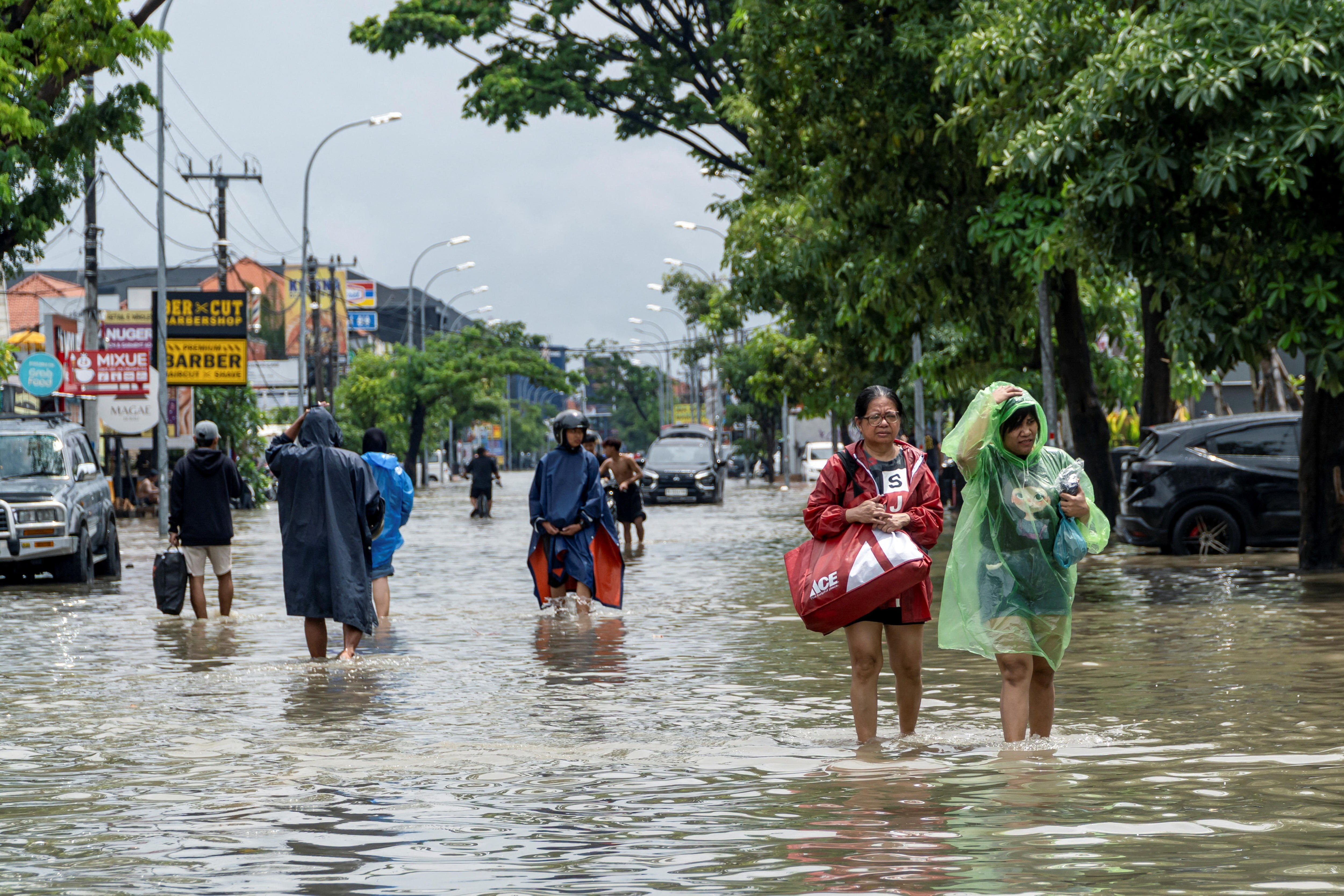 At least 14 dead in Bali as floods inundate homes, force evacuations ...