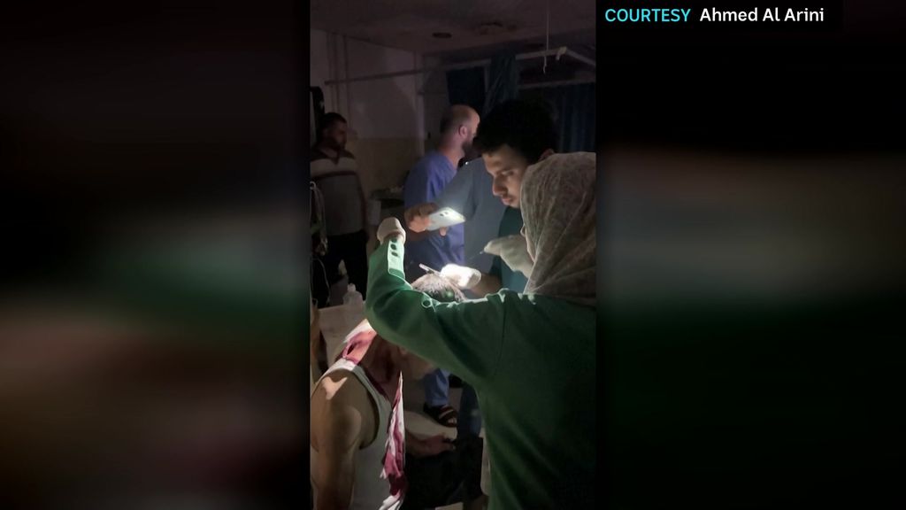 Medical staff stitches patient at a blacked out gaza hospital - ABC News