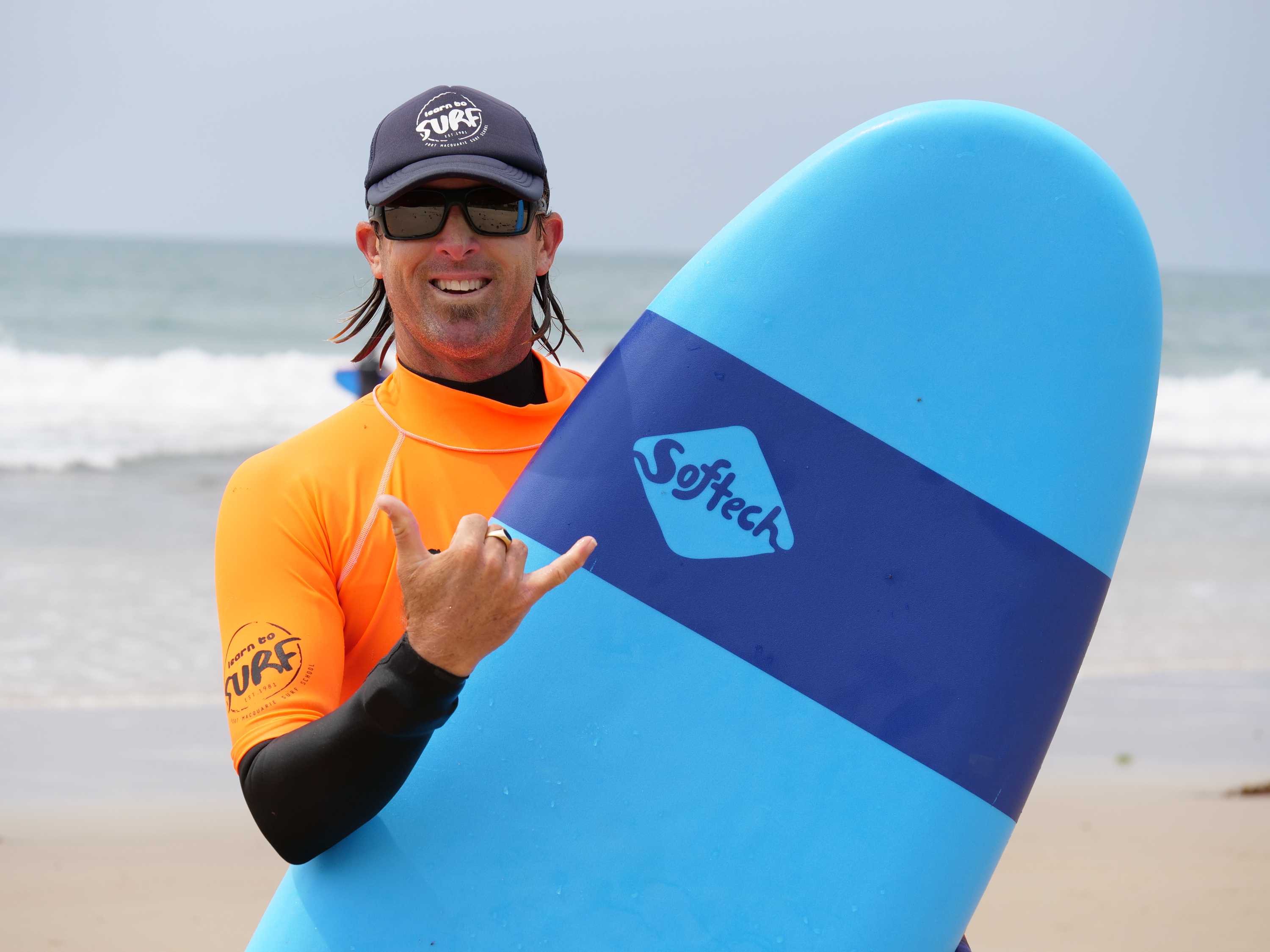 Surfing coach was told he'd never be able to ride the waves, but he's ...