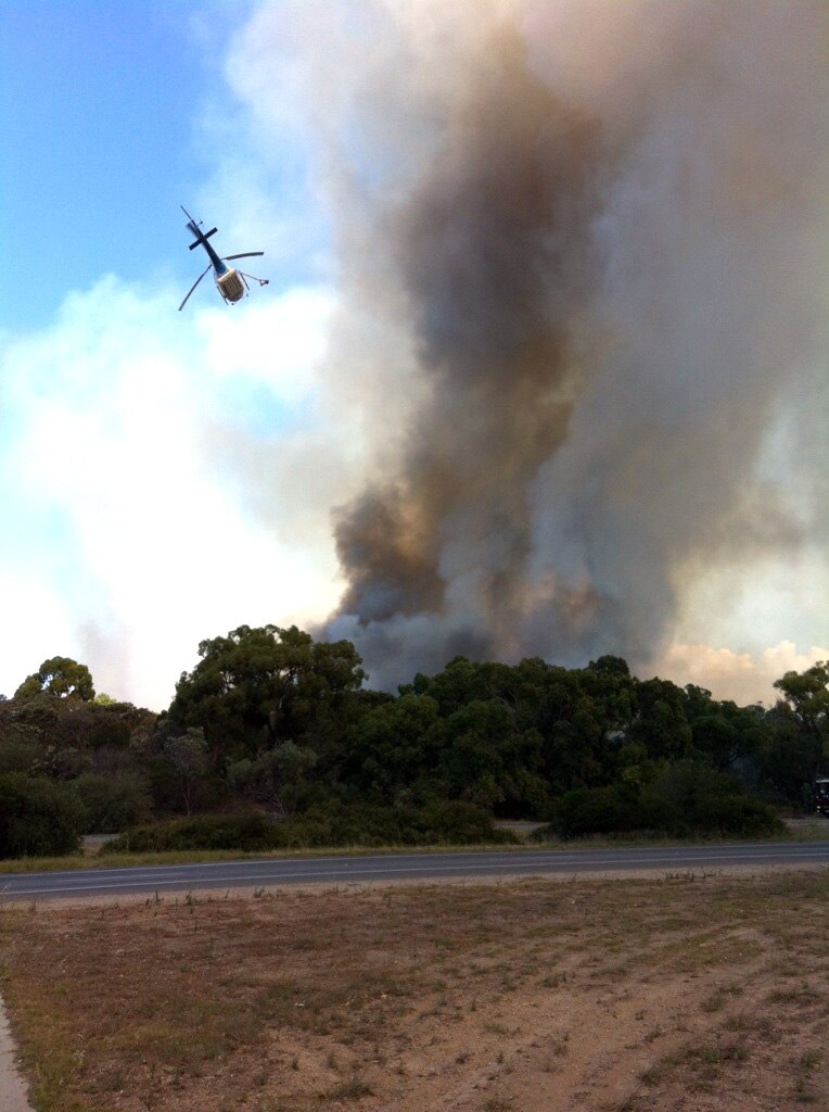 Evacuations as fire crosses major highway - ABC News