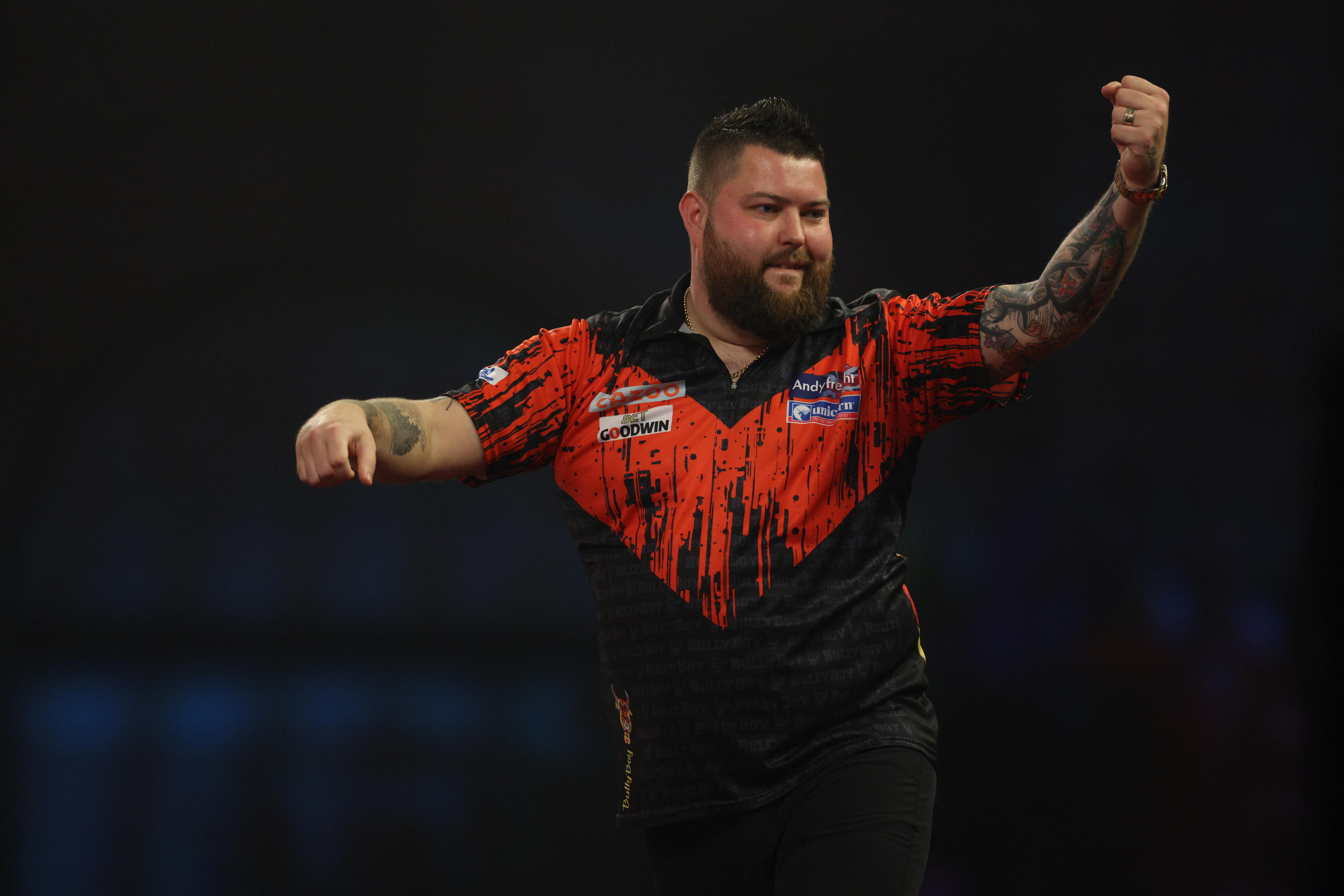 England's Michael Smith hits a nine-dart finish on the way to the PDC ...