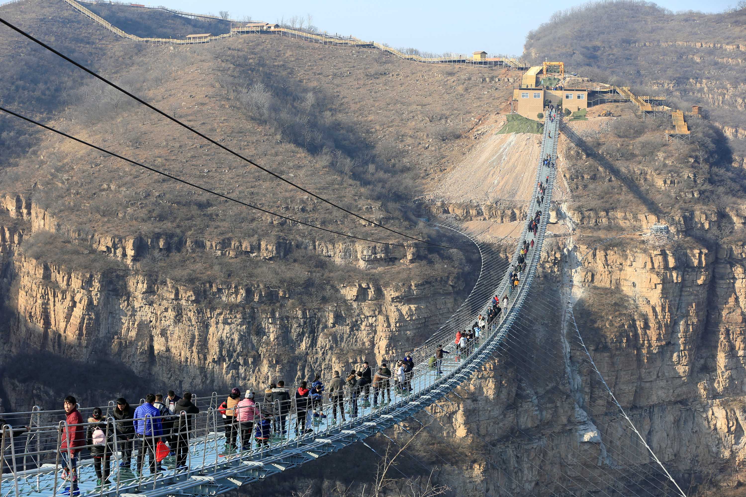 China closes 'scary' glass bridges due to 'safety problems' - ABC News