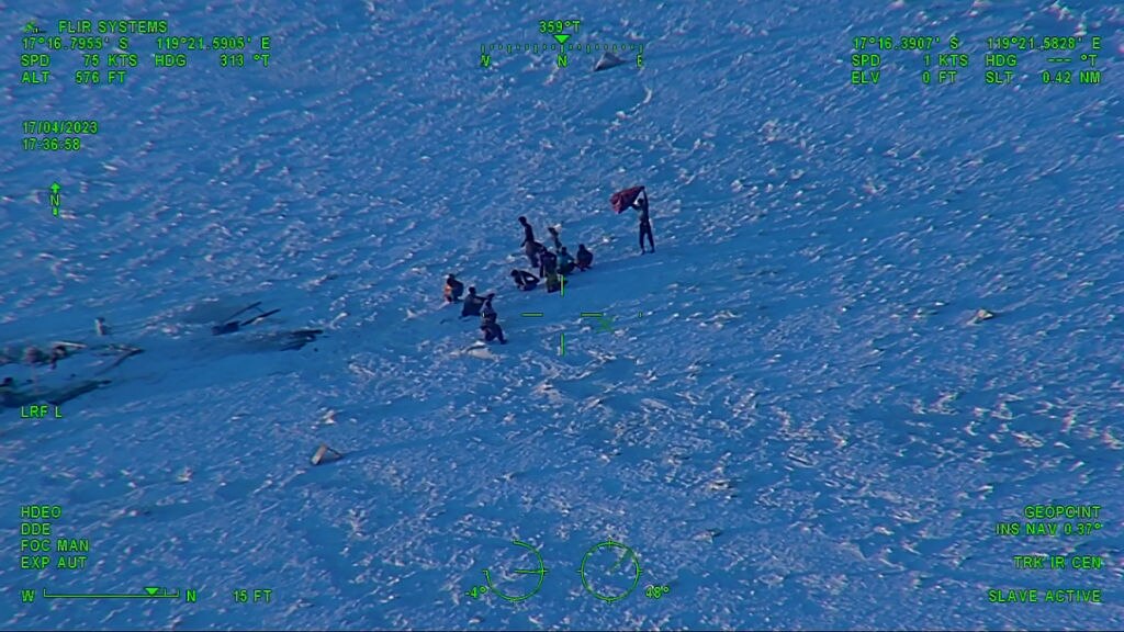Footage shows rescue of fishermen stranded on island off WA after ...