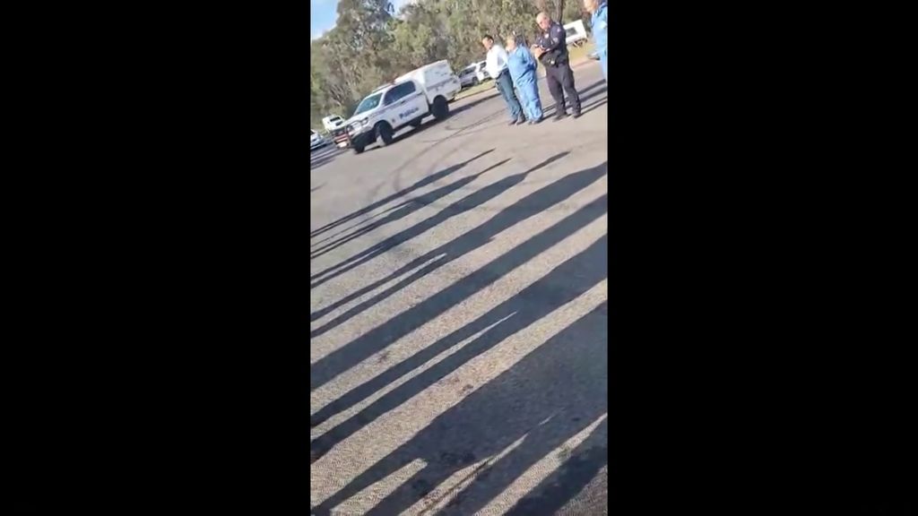 Locals formed a guard of honour for the two officers and Alan Dare, who ...