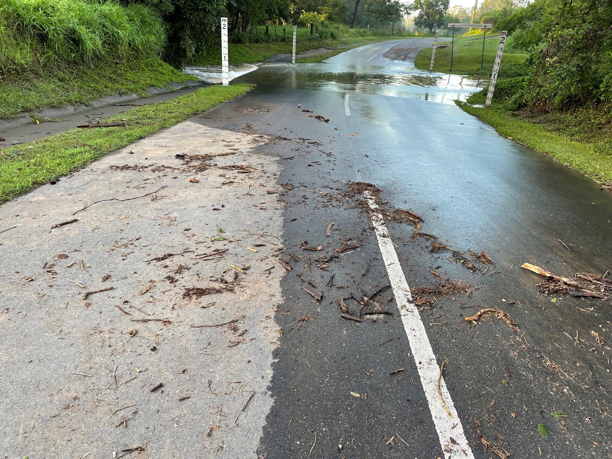 Woman dies after car swept away in 'treacherous' floodwaters in ...