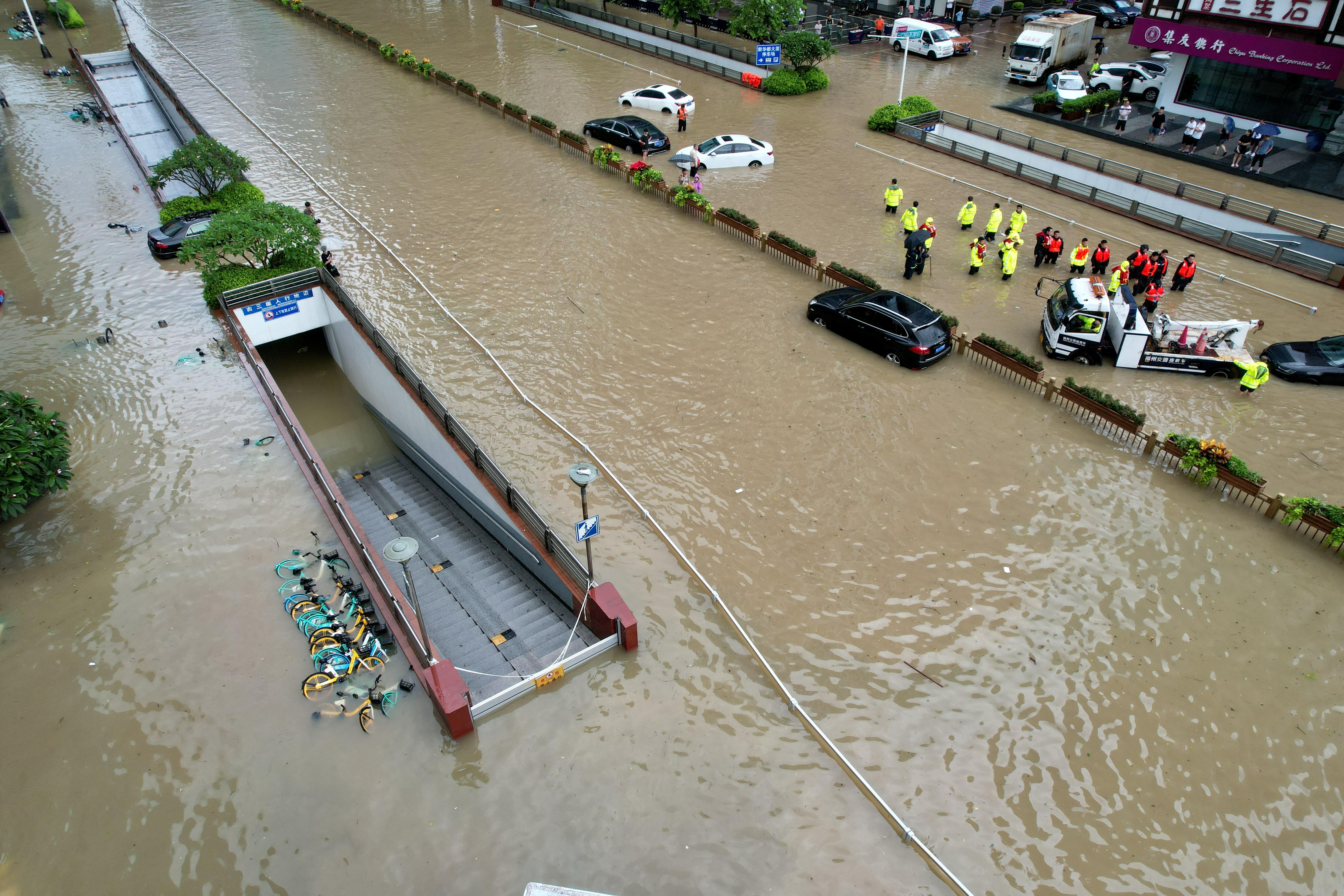 Scenes of devastation and dramatic rescues as Typhoon Doksuri drenches ...